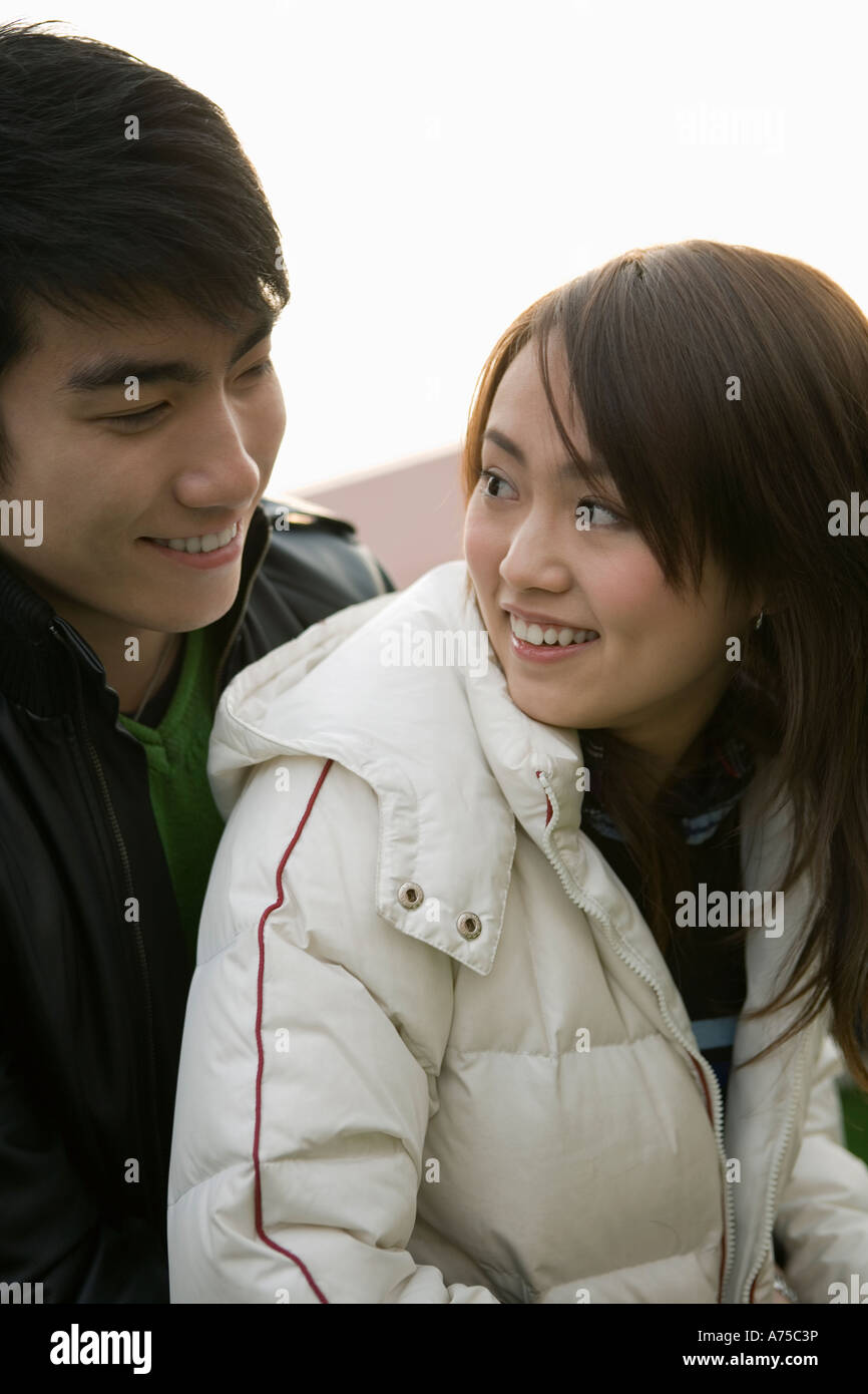 Couple smiling at each other Stock Photo - Alamy