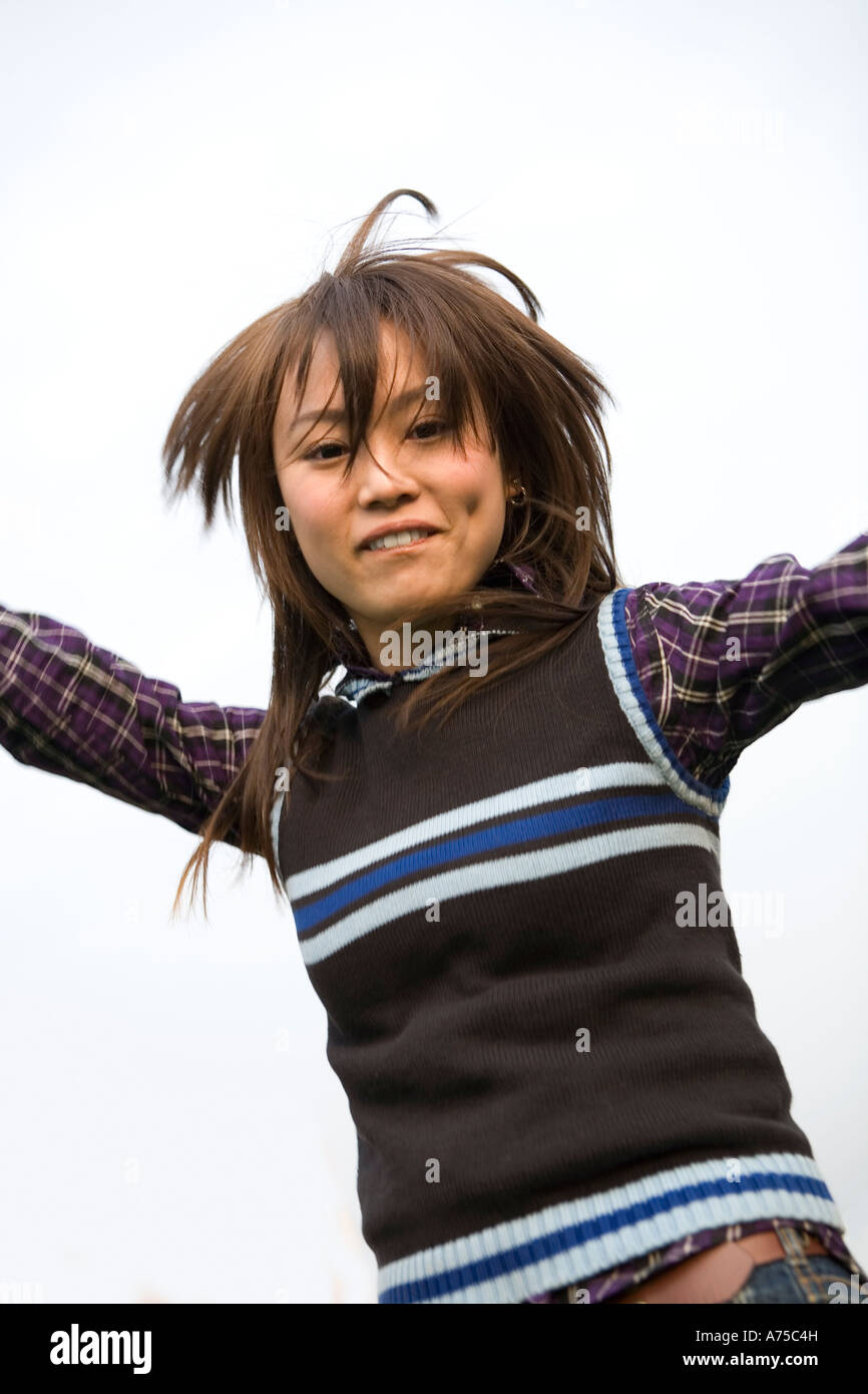 Woman jumping for joy Stock Photo - Alamy