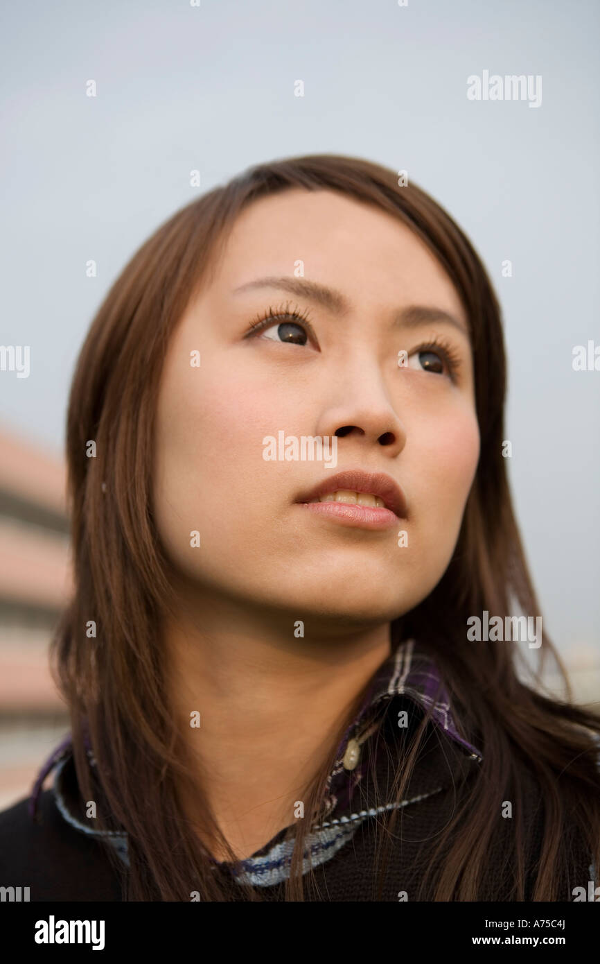 Woman looking upwards Stock Photo - Alamy