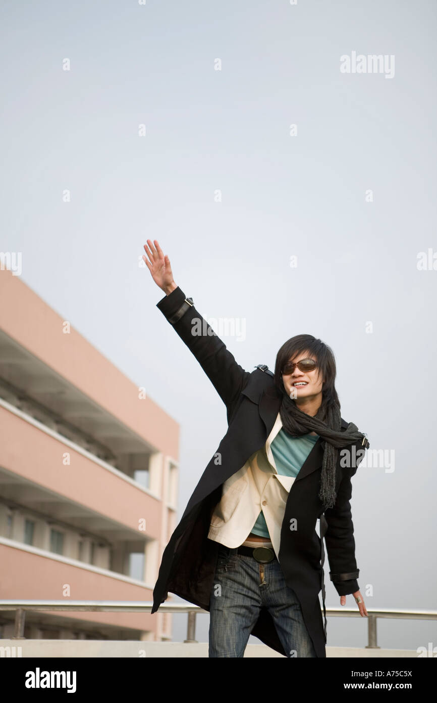Man raising his arm Stock Photo - Alamy