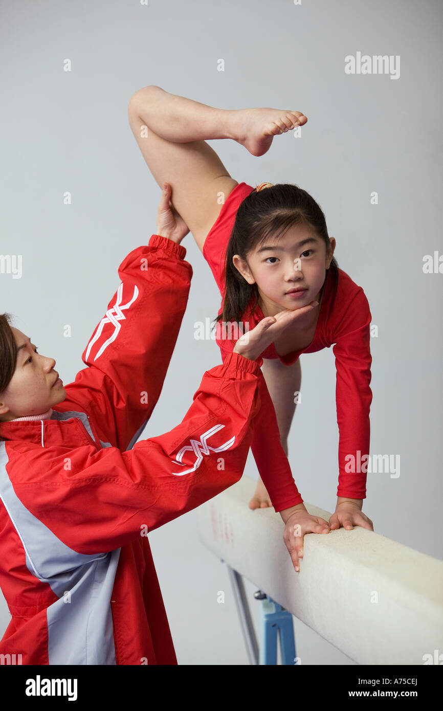 Young girl learning gymnastics Stock Photo - Alamy