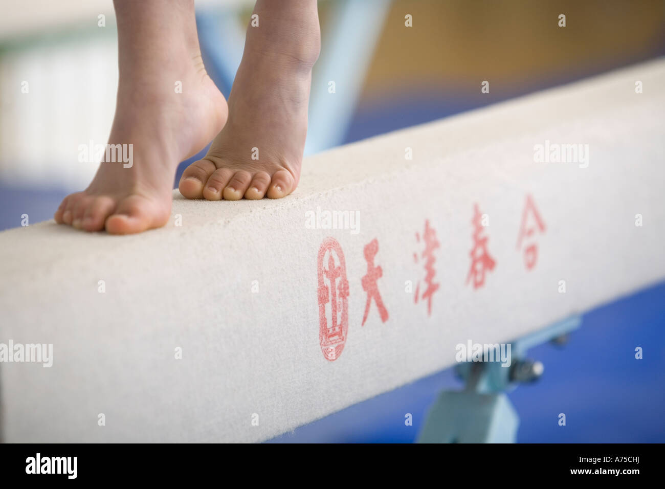 Young girl walking on balance beam Stock Photo - Alamy