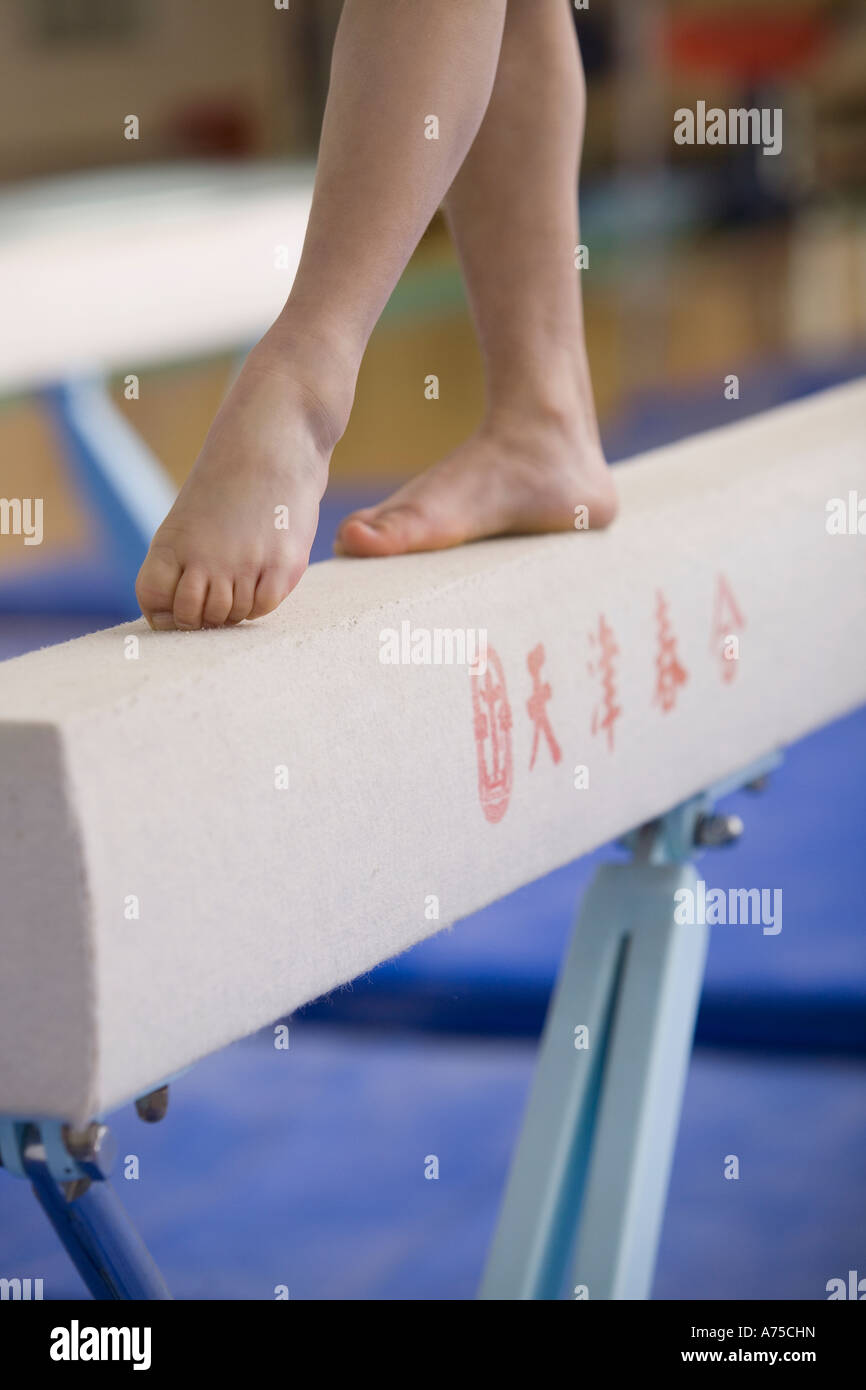 Young girl walking on balance beam Stock Photo - Alamy
