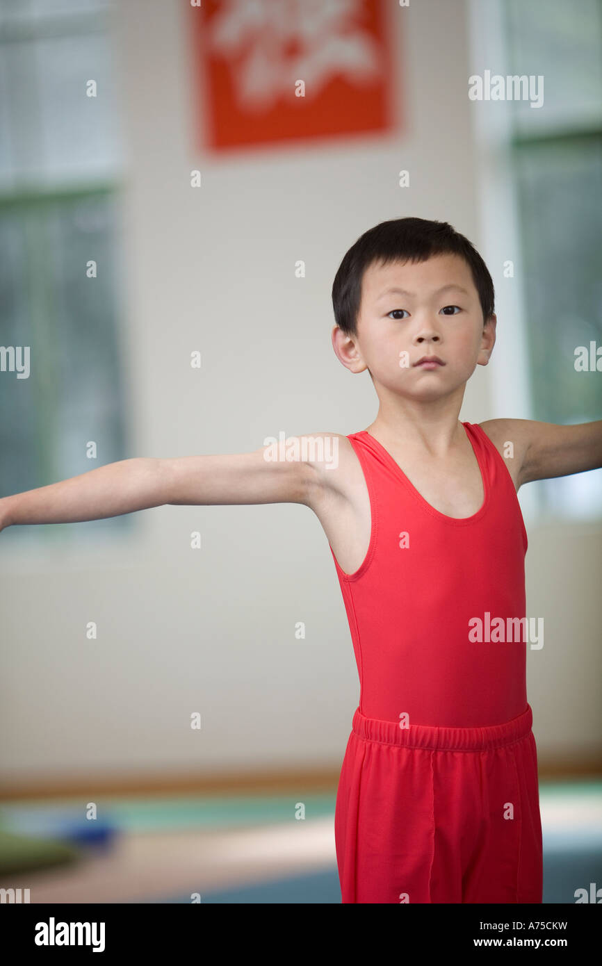 Young boy stretching Stock Photo - Alamy