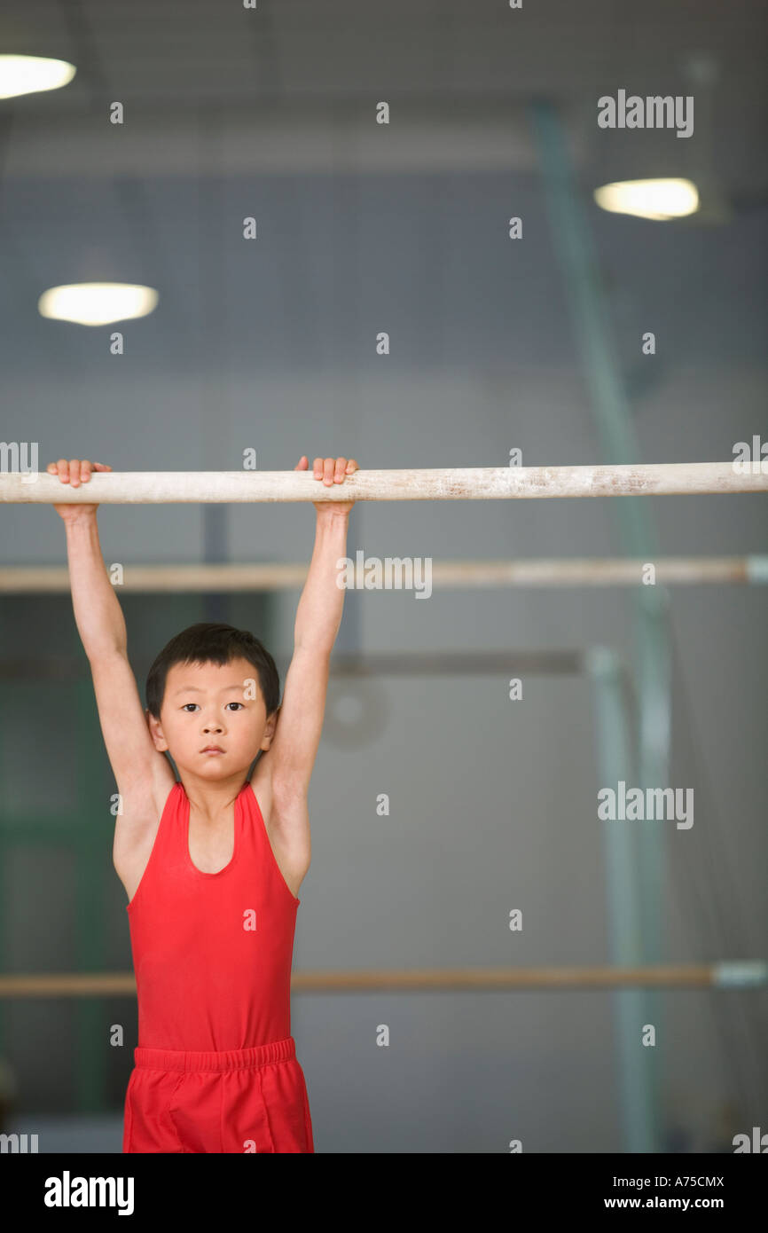 Young boy practicing gymnastics Stock Photo - Alamy