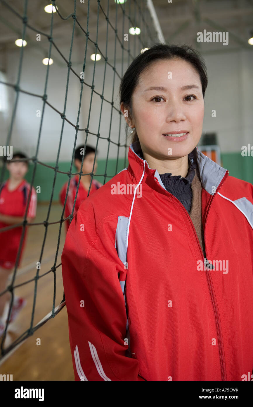 Female athletic coach smiling Stock Photo - Alamy