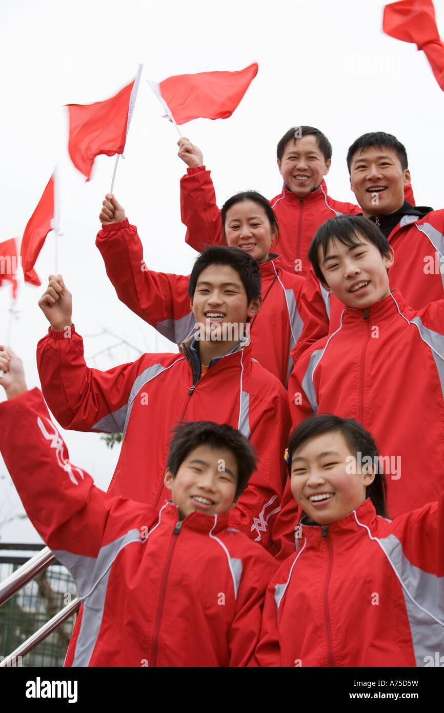Athletes waving national flags Stock Photo - Alamy