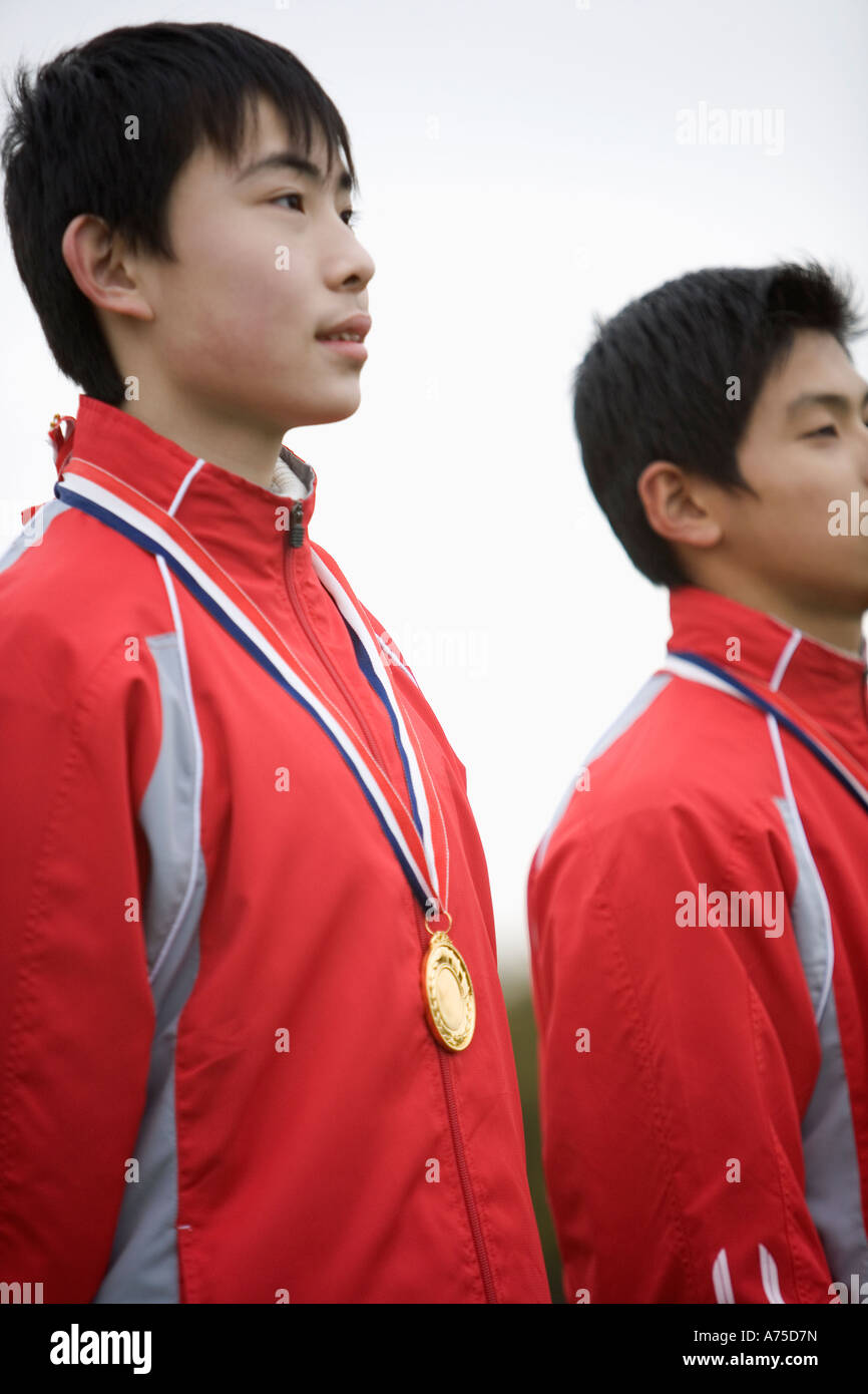 Male athlete wearing a gold medal Stock Photo - Alamy
