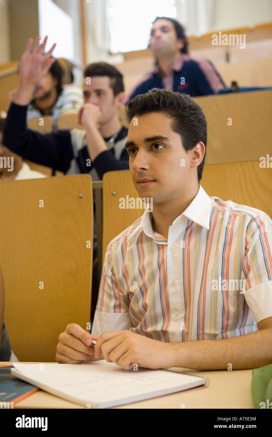 Male student sitting in class Stock Photo - Alamy