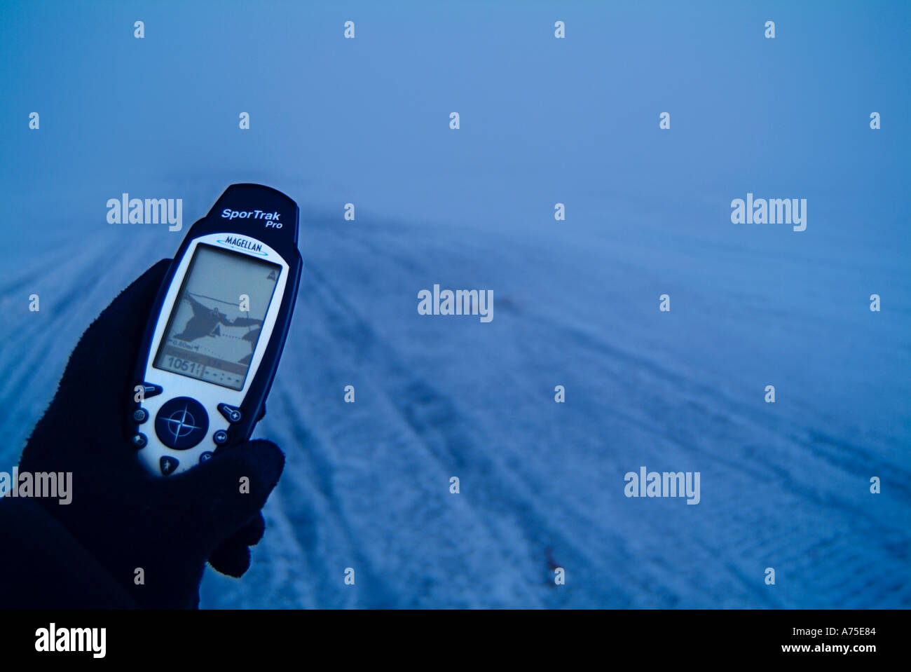 Hand holding a GPS receiver in the fog Stock Photo - Alamy