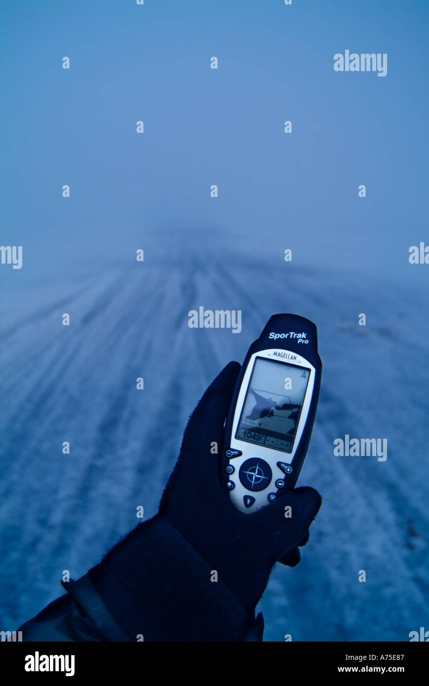 Hand holding a GPS receiver in the fog Stock Photo - Alamy