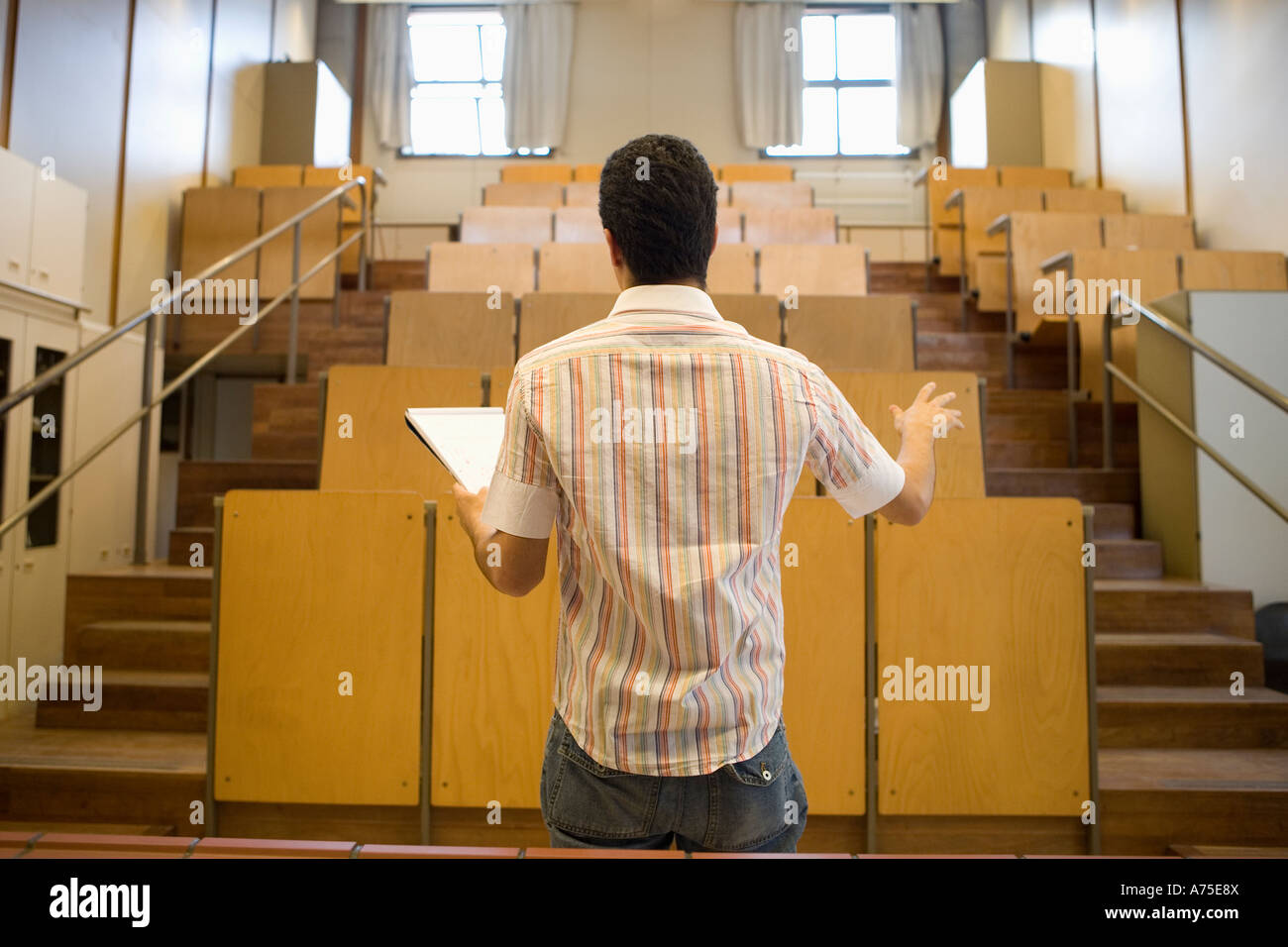 Student talking empty classroom hi-res stock photography and images - Alamy