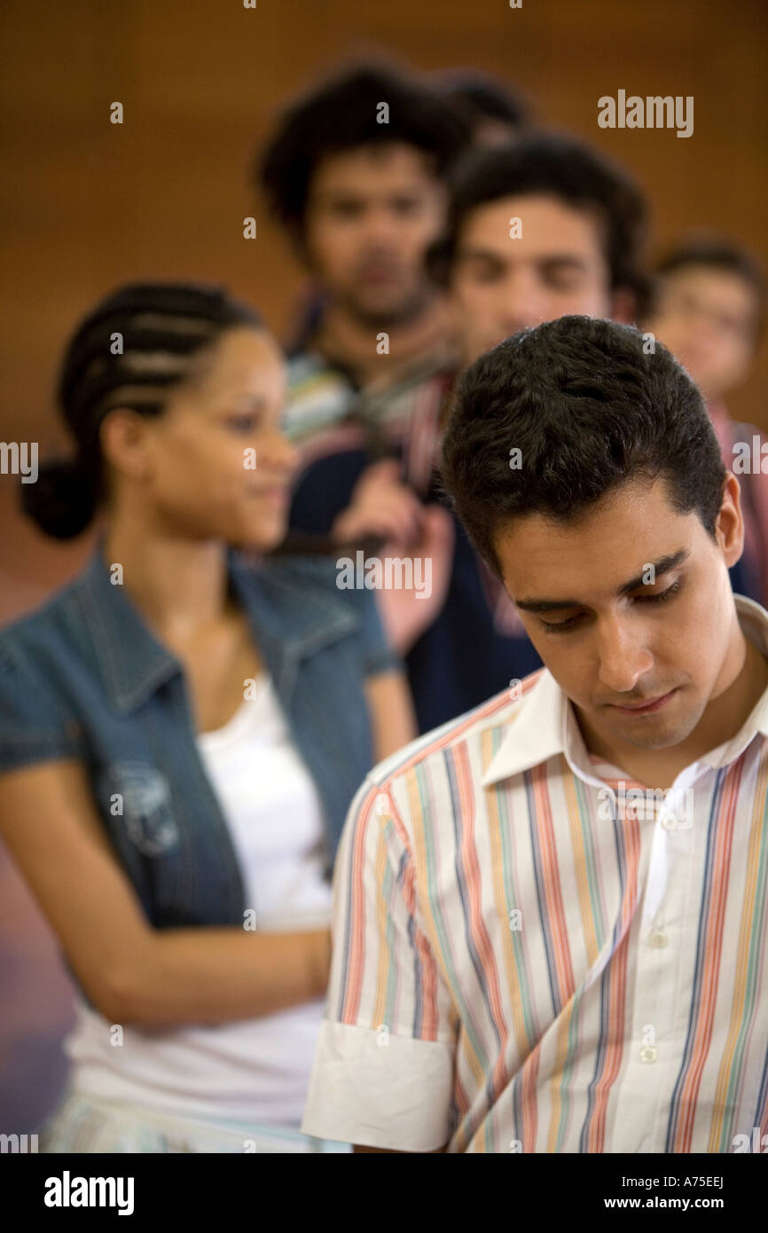 Man waiting in single-file line Stock Photo - Alamy