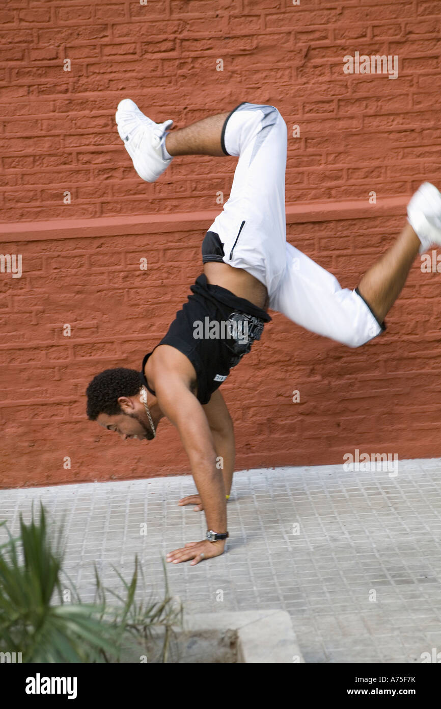 Man breakdancing on urban street Stock Photo - Alamy