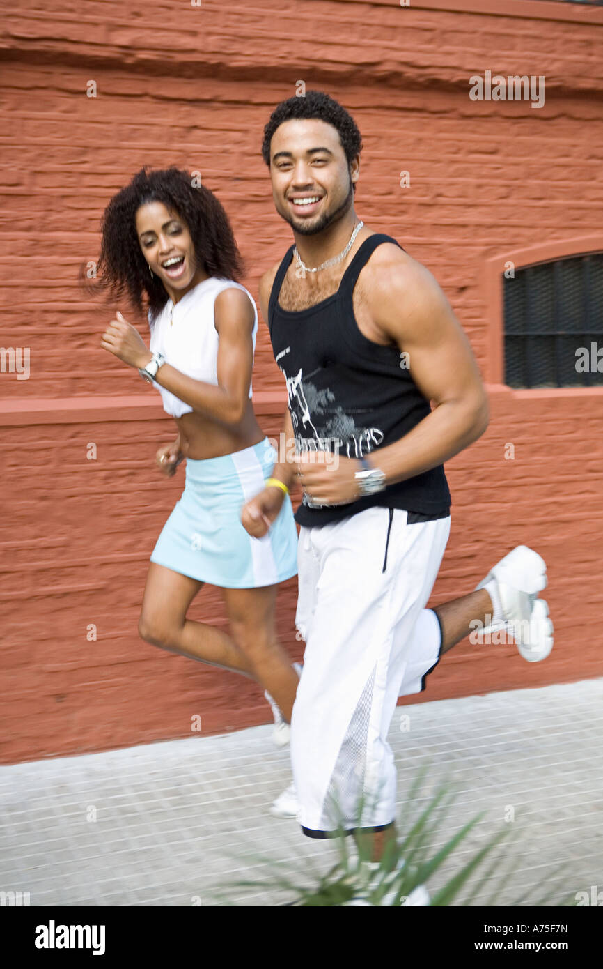 Couple jogging together Stock Photo - Alamy