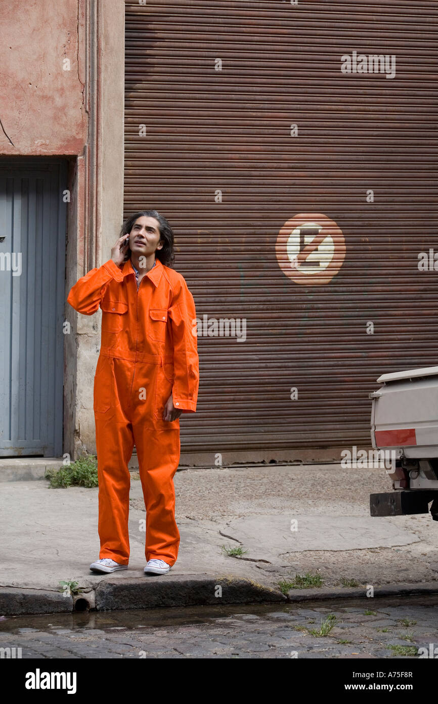 Blue-collar employee standing on urban street Stock Photo - Alamy