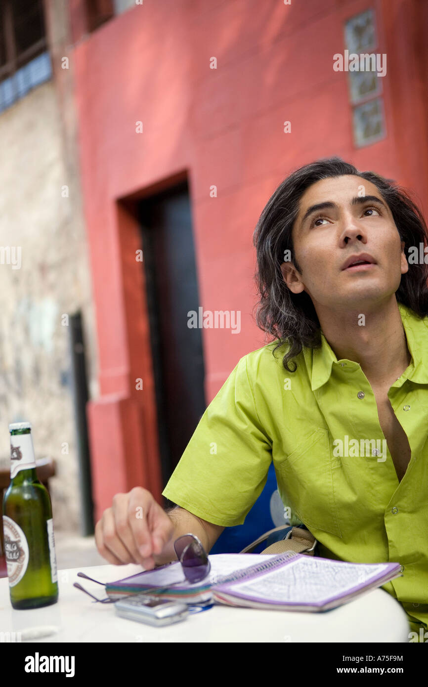 Man sitting at outdoor table Stock Photo - Alamy