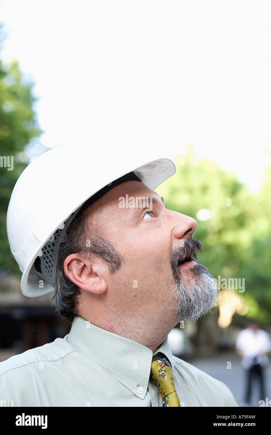 Profile of man in hard hat Stock Photo - Alamy