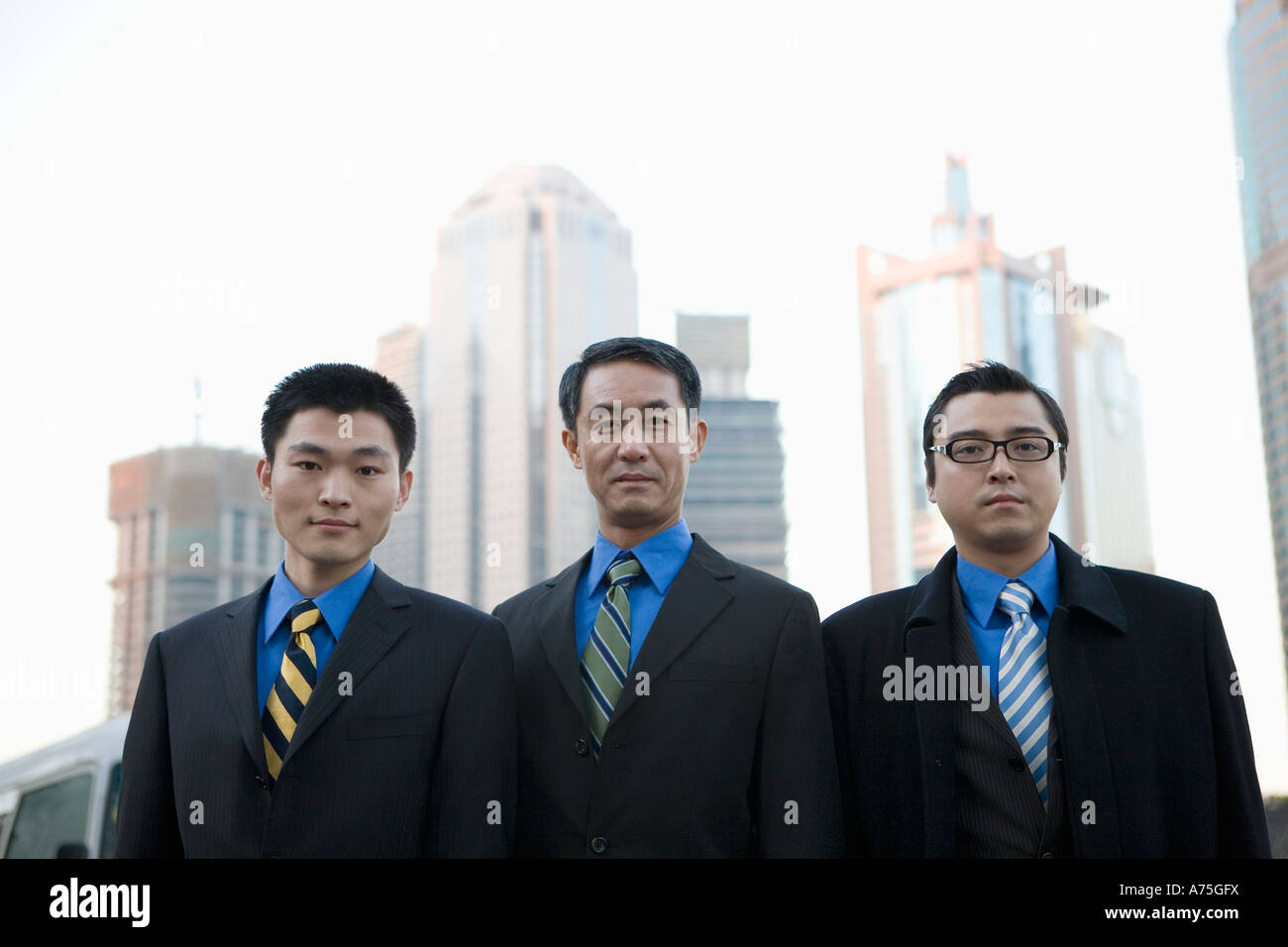 Businessmen standing in a line Stock Photo - Alamy