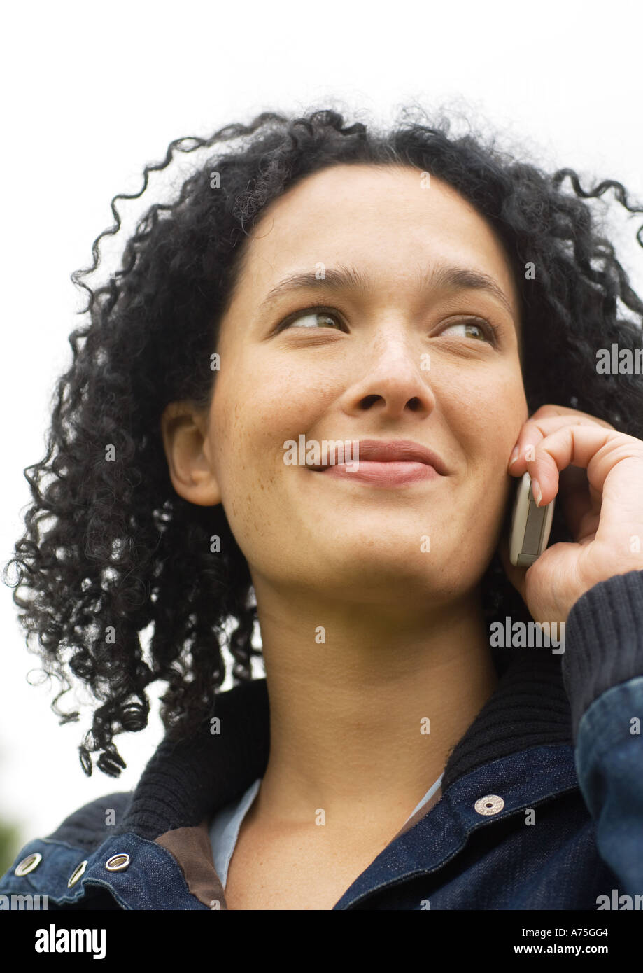 Young woman using cell phone Stock Photo - Alamy
