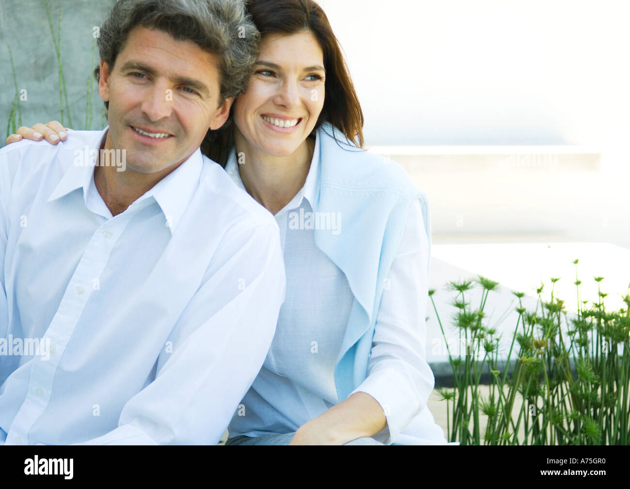 Loving couple in white shirts hi-res stock photography and images - Alamy