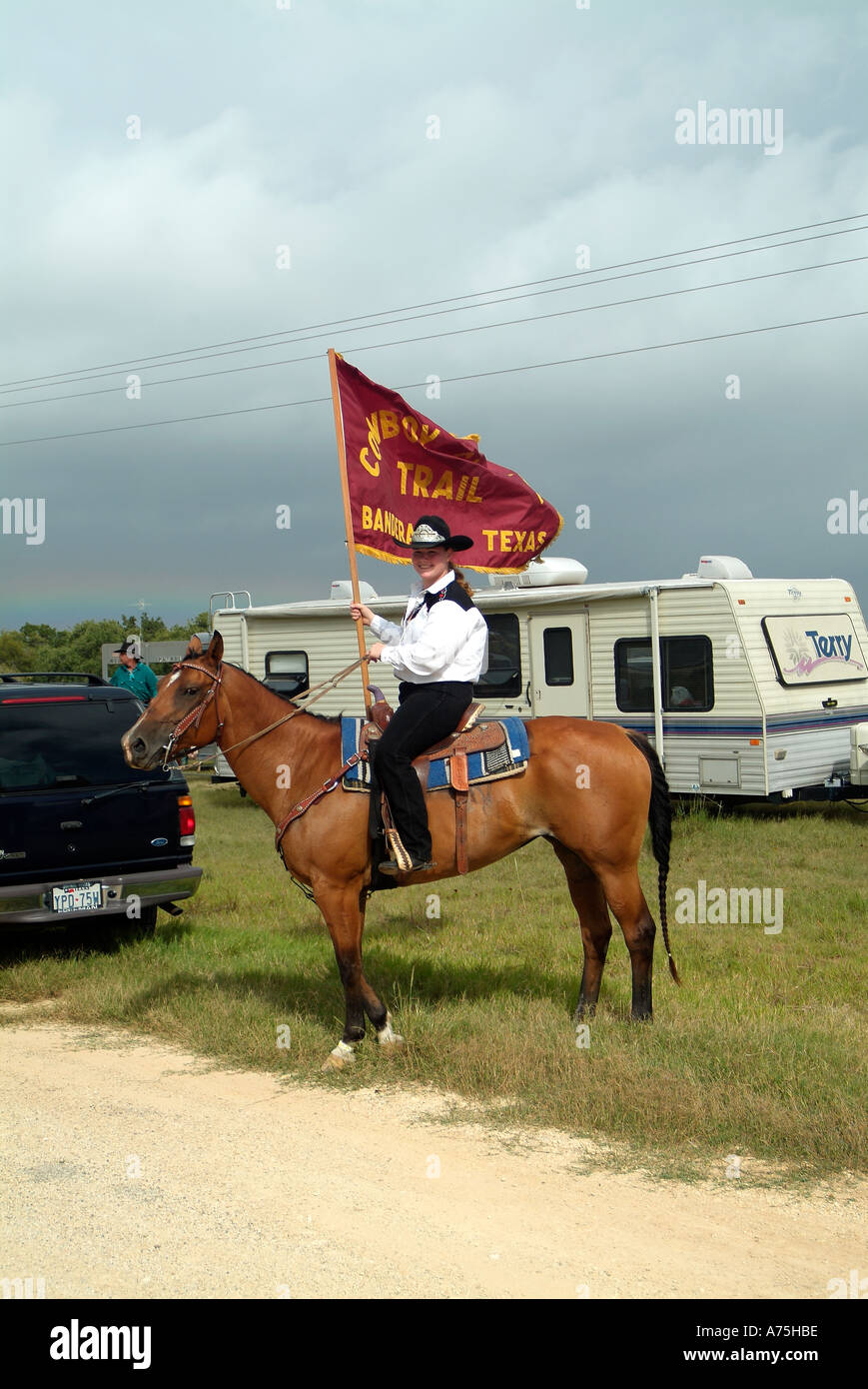 Woman with a flag riding a horse Stock Photo - Alamy