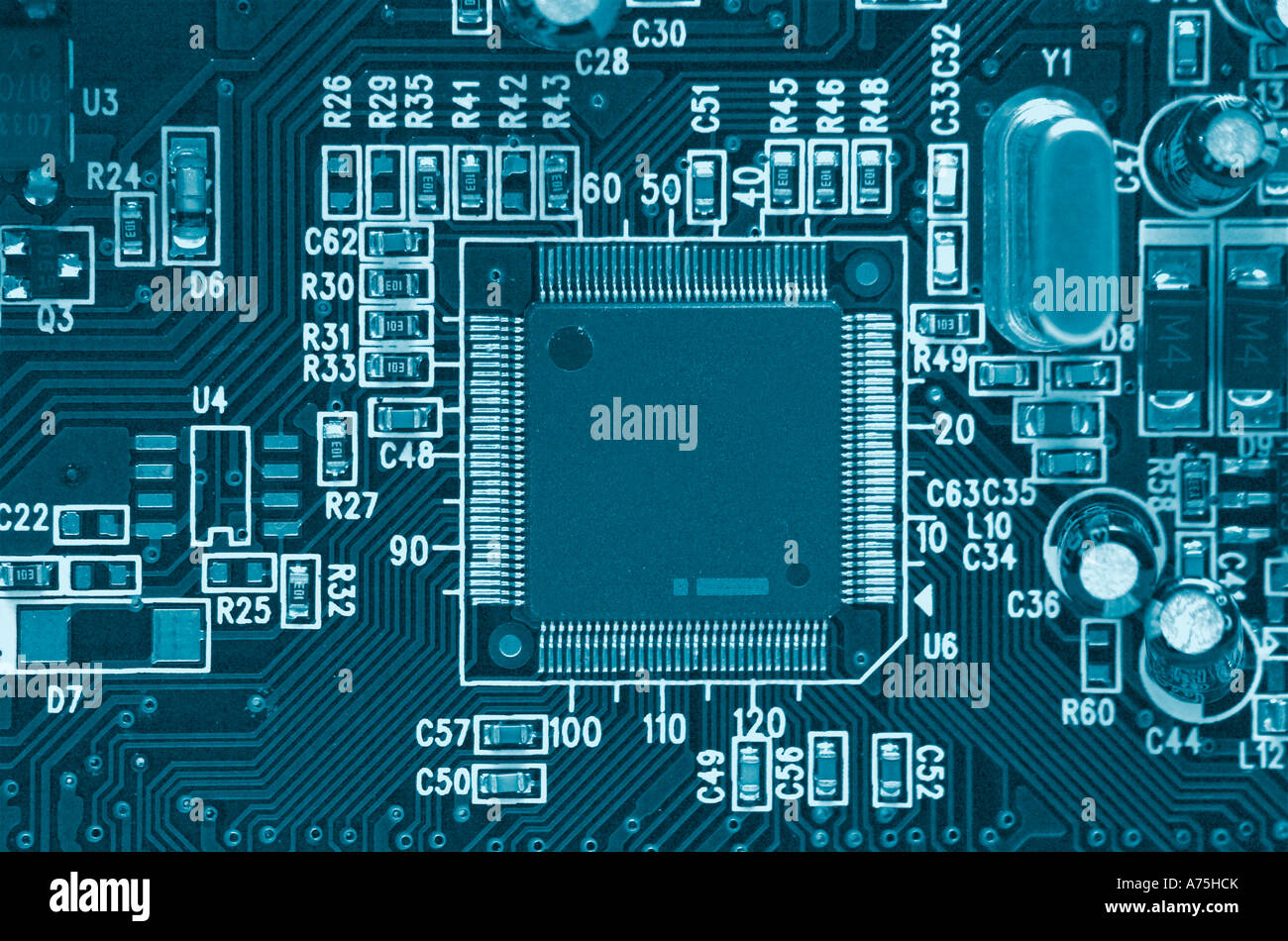 Microchips on circuit board close up blue tone Stock Photo - Alamy