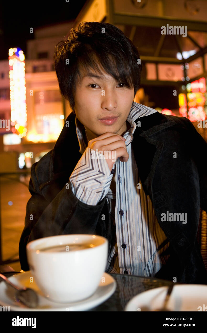 Man having cup of coffee Stock Photo - Alamy