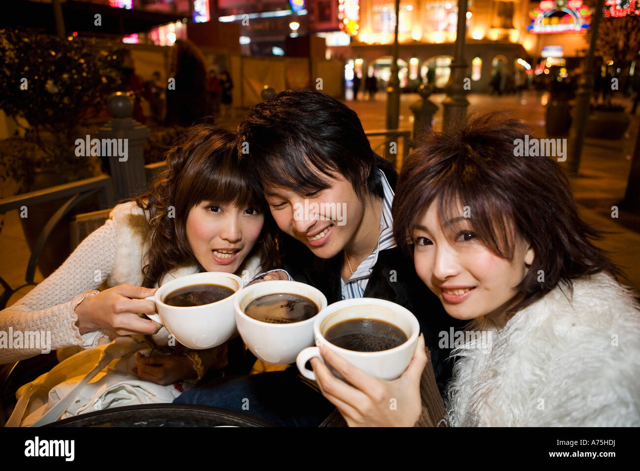 Friends having coffee together Stock Photo - Alamy
