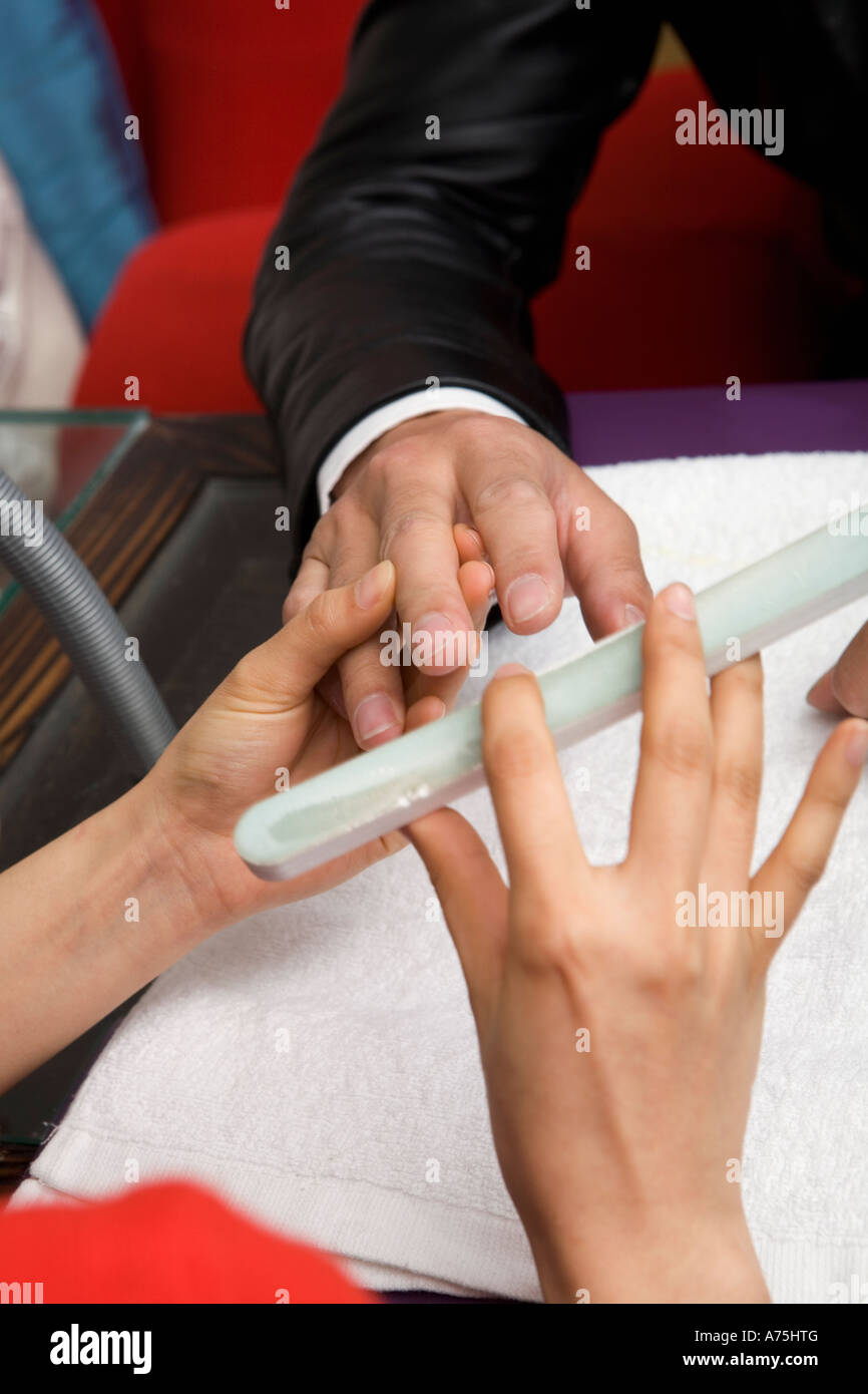 Man getting a manicure Stock Photo - Alamy