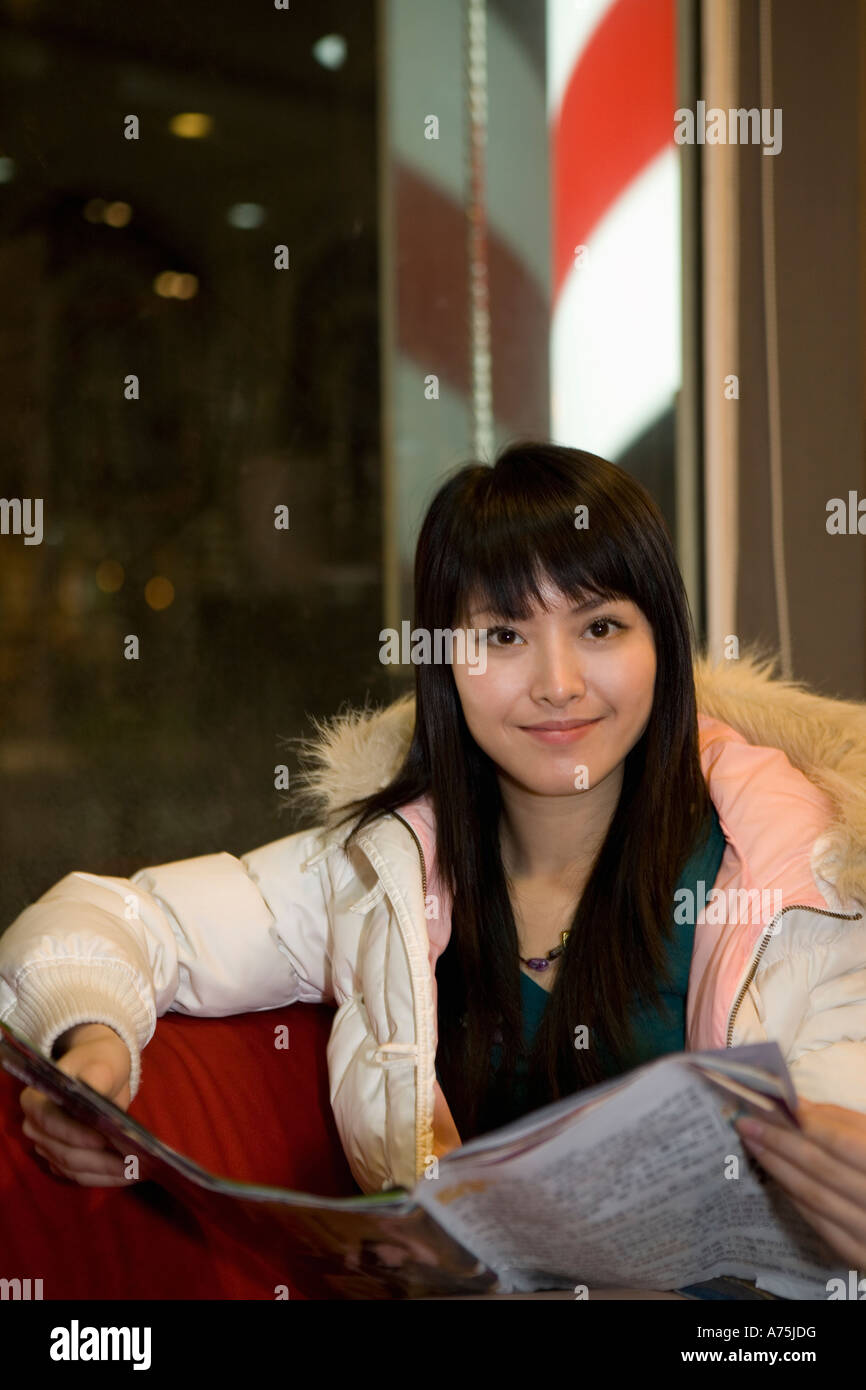 Woman reading a magazine Stock Photo - Alamy