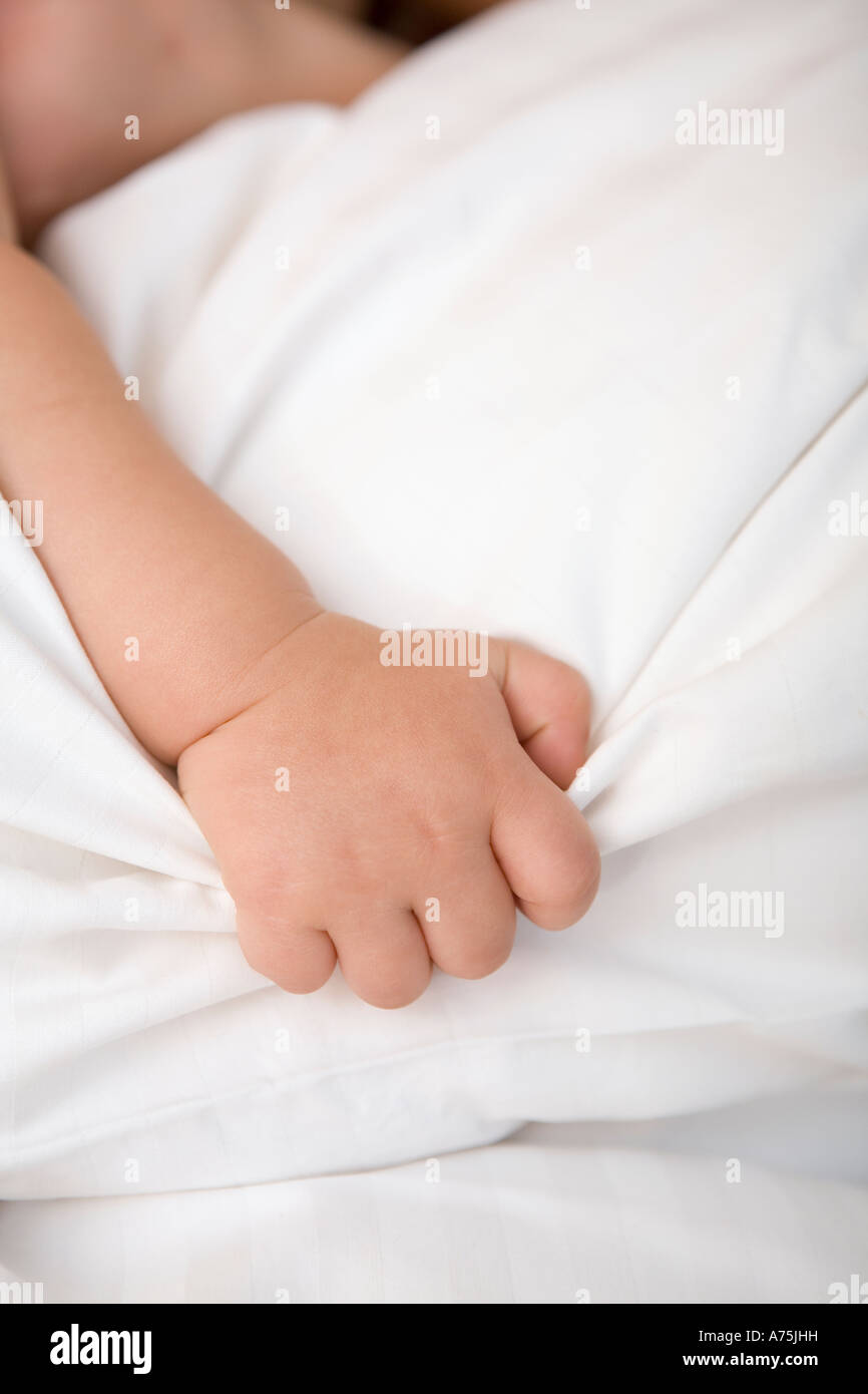 Hand grabbing sheet hi-res stock photography and images - Alamy