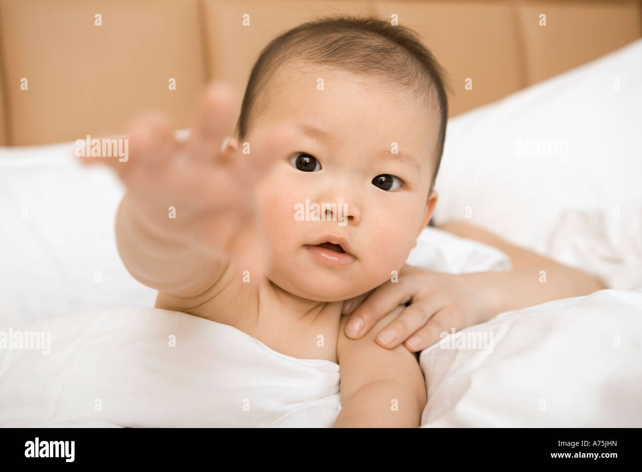 Baby reaching camera hi-res stock photography and images - Alamy