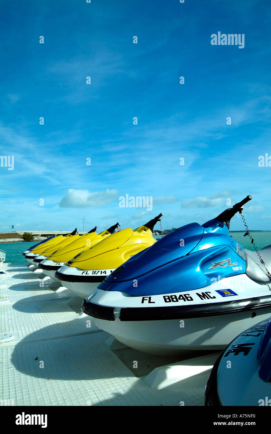 Alignment of jet ski along a pier Stock Photo - Alamy