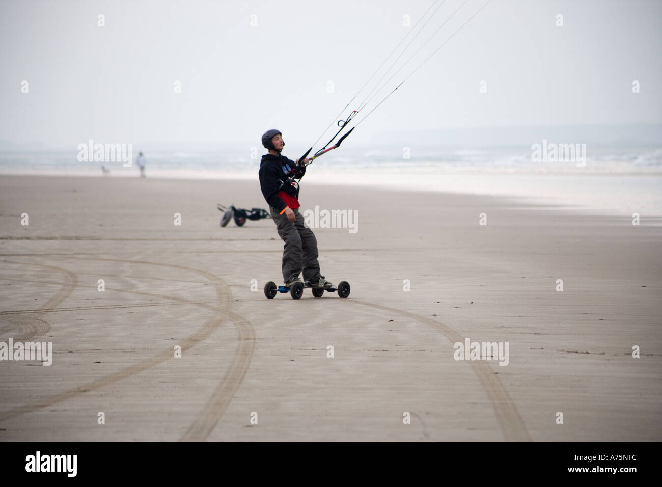 Kite skateboarding at Black Rock Sands North Wales UK Stock Photo - Alamy