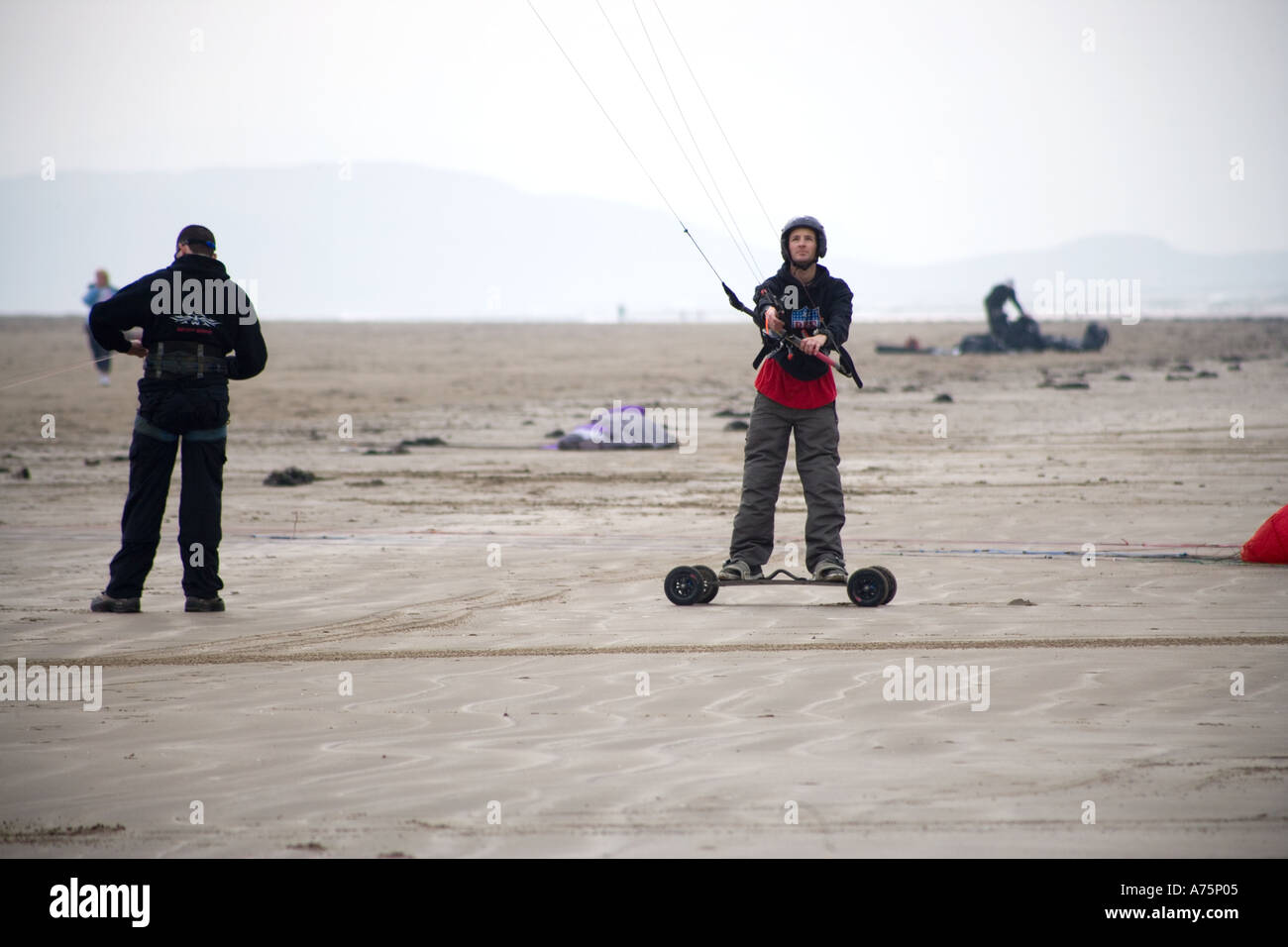 Kite skateboarding at Black Rock Sands North Wales UK Stock Photo - Alamy