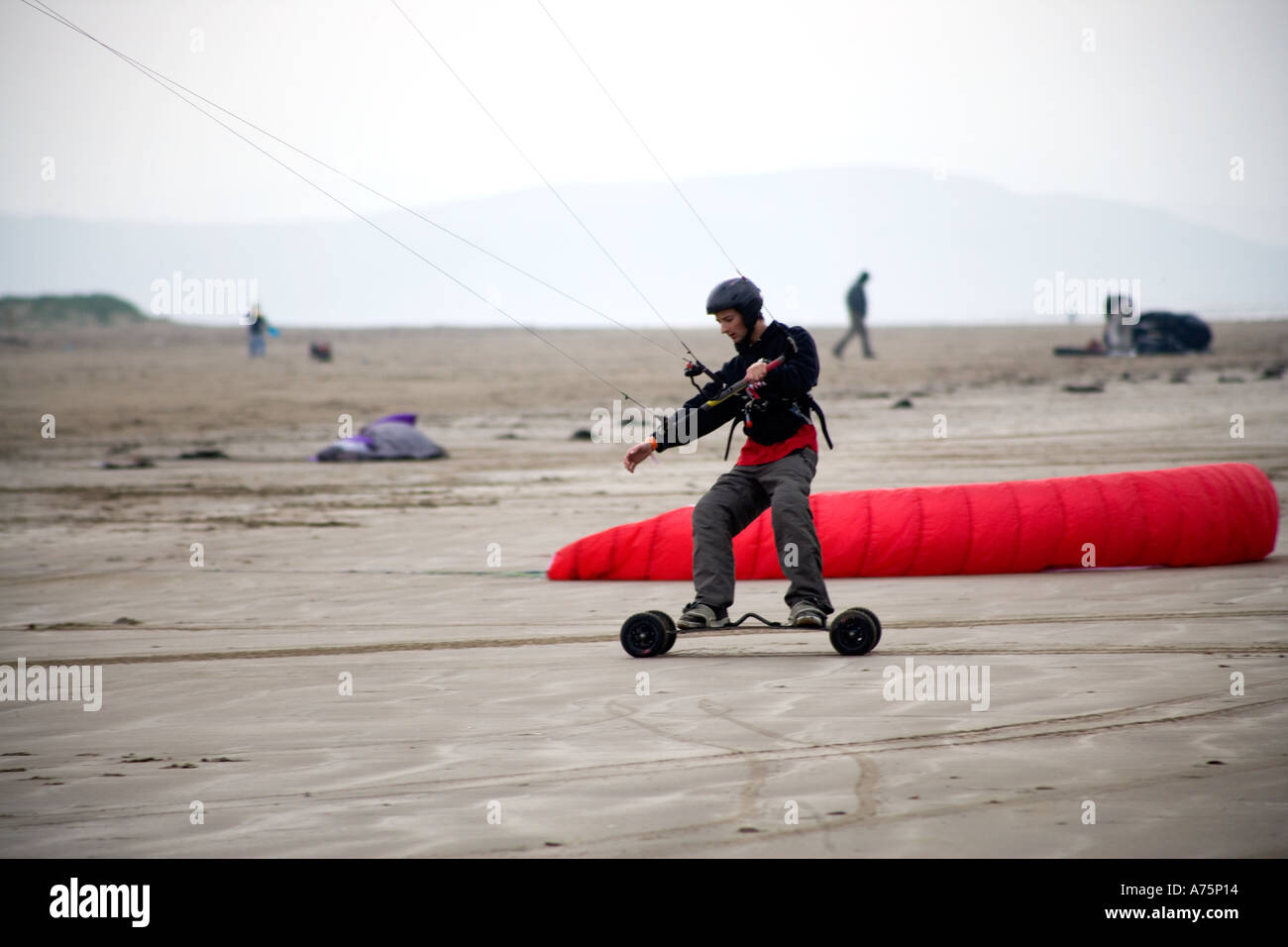 Kite skateboarding at Black Rock Sands North Wales UK Stock Photo - Alamy