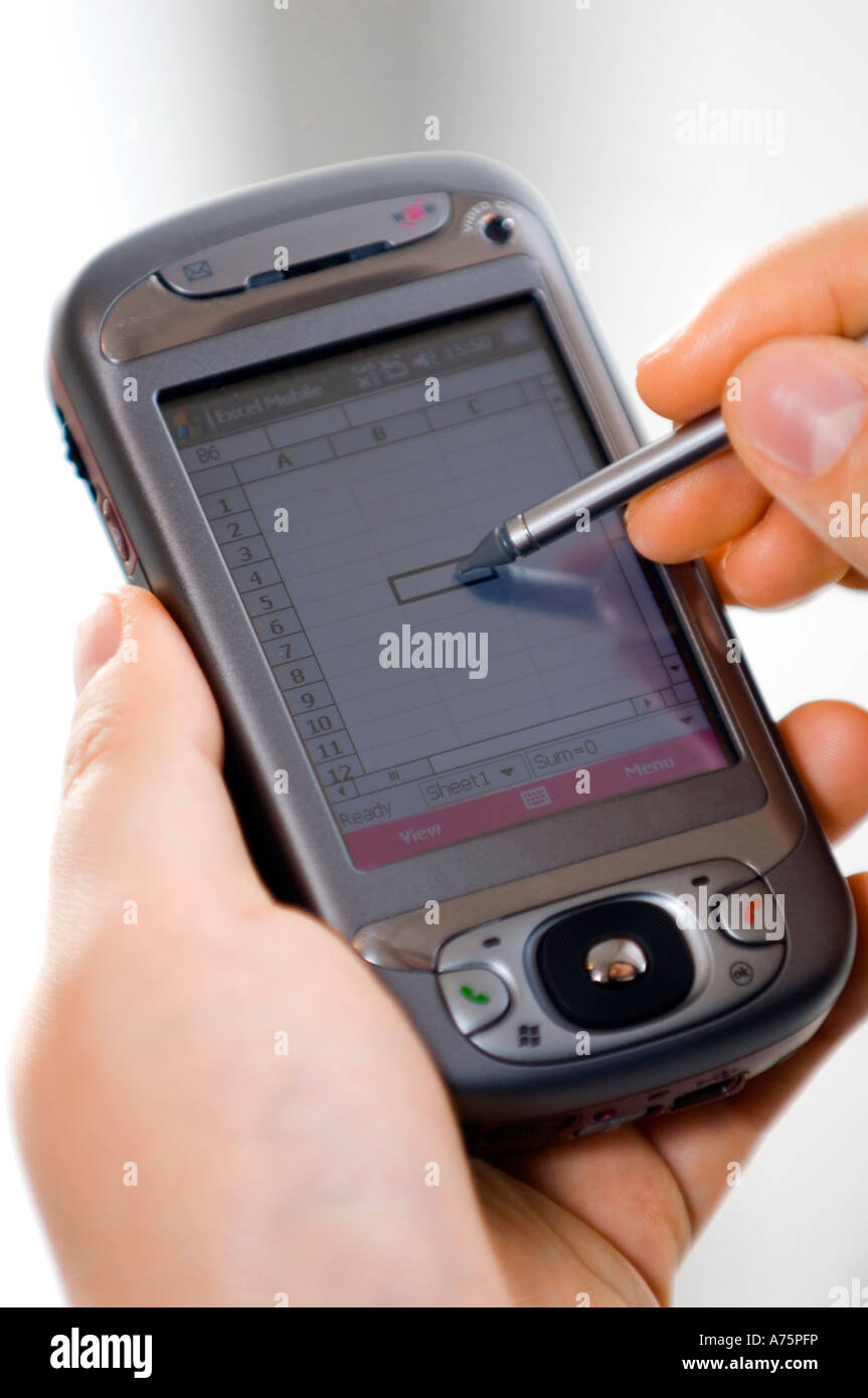 White womans hands holding and operating a modern mobile cell phone ...