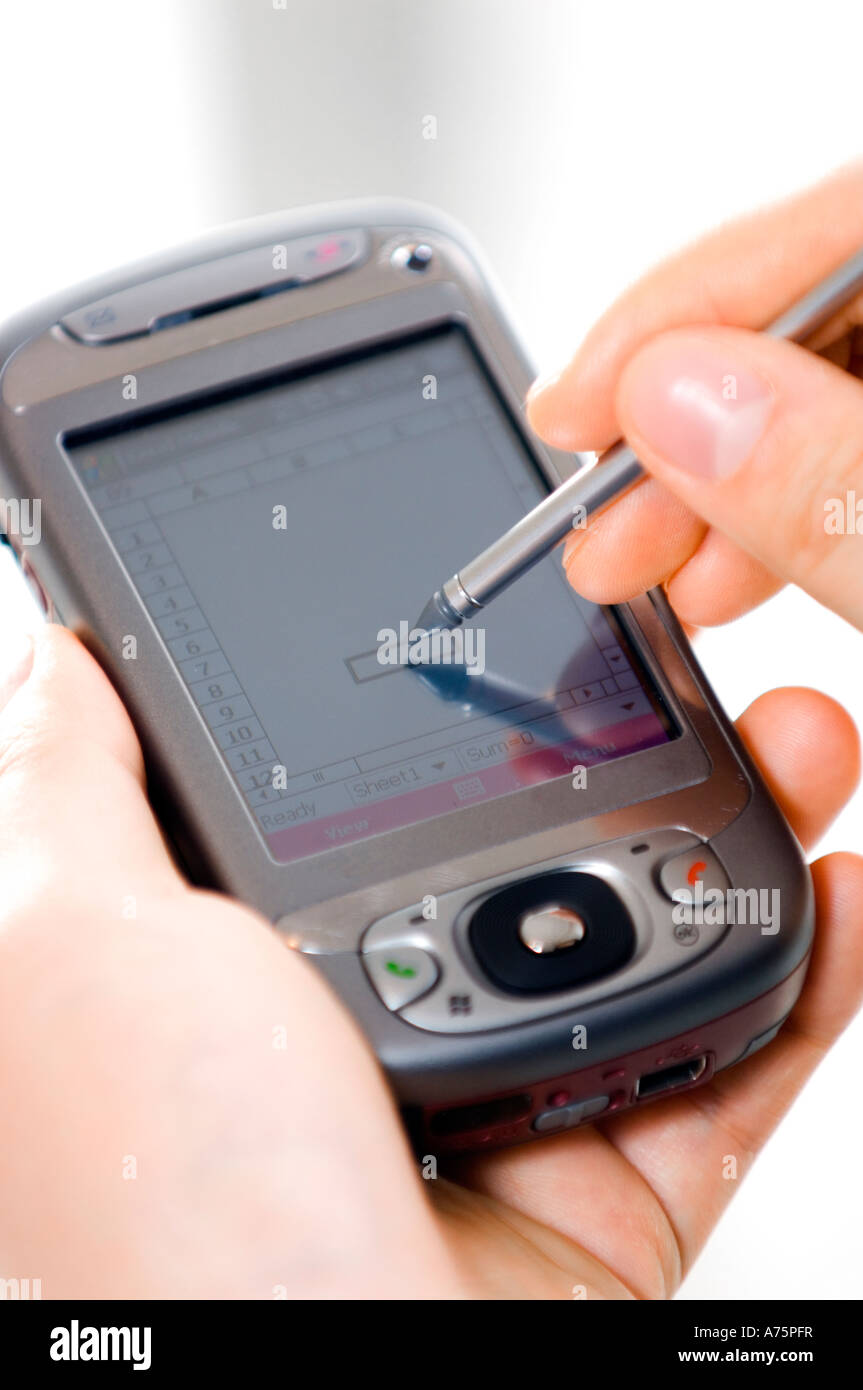 White womans hands holding and operating a modern mobile cell phone ...