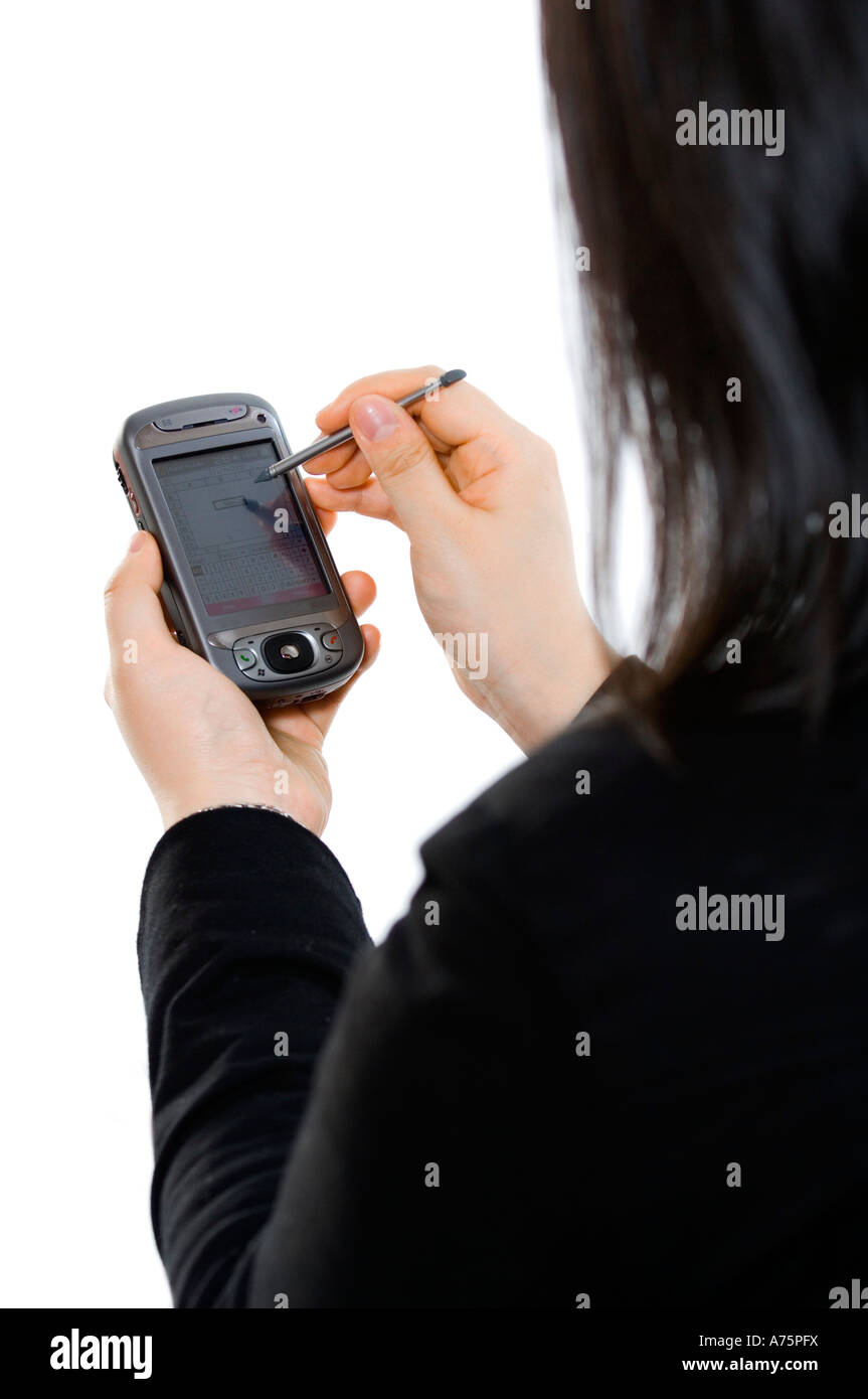 White womans hands holding and operating a modern mobile cell phone ...