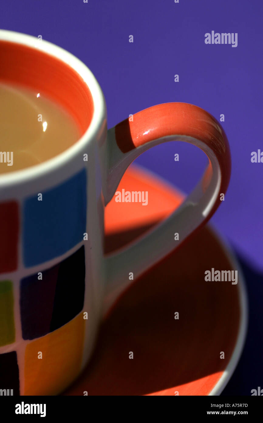Tea in a multicoloured cup Stock Photo - Alamy
