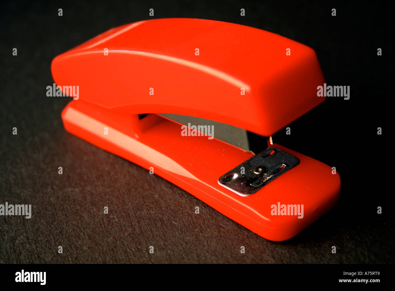 Single Red Stapler on Black background Stock Photo - Alamy