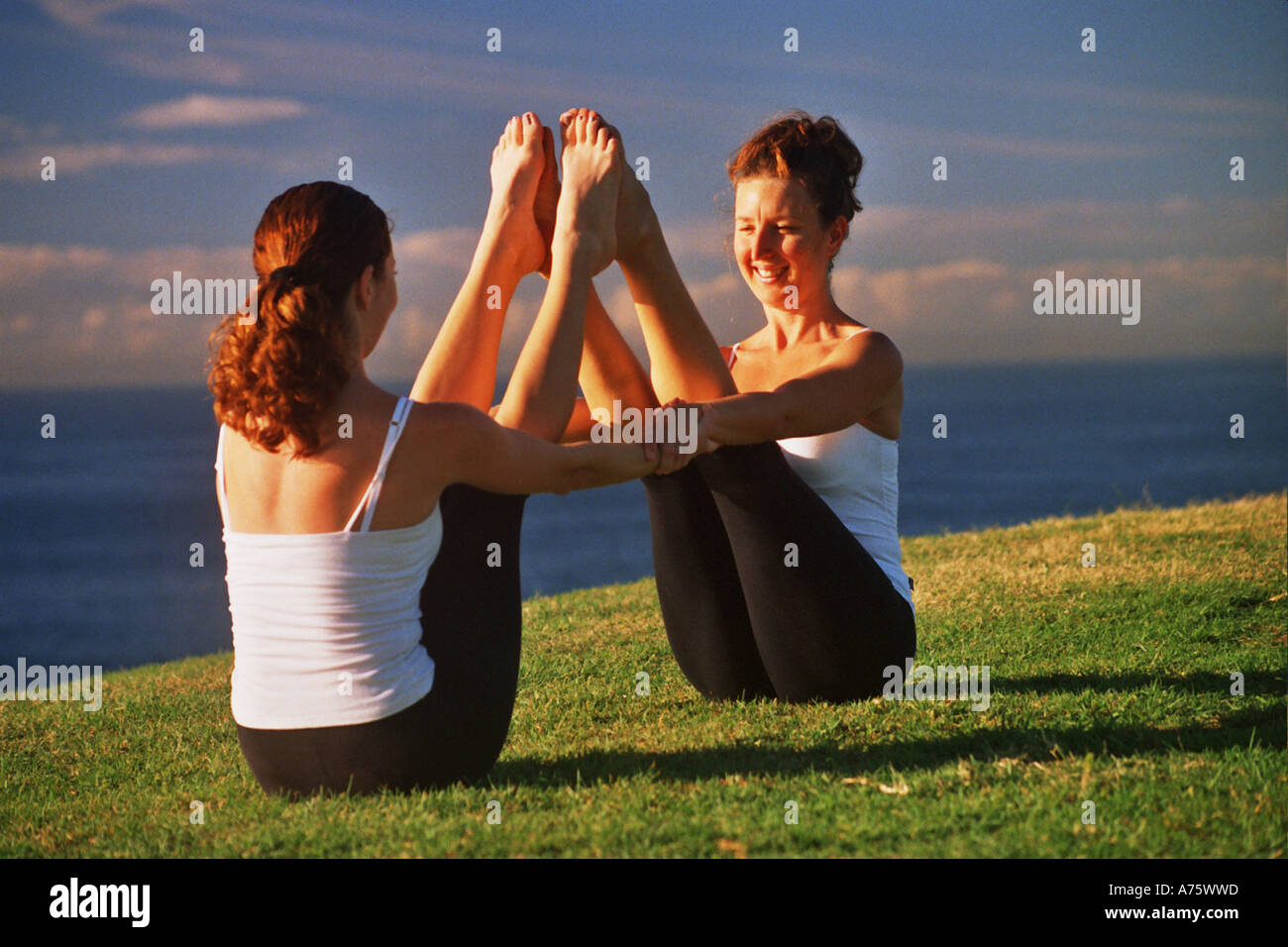 Yoga partner exercise Stock Photo - Alamy