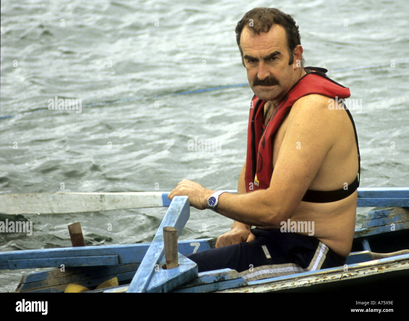 rower getting ready for start of traditional currach race Dingle ...