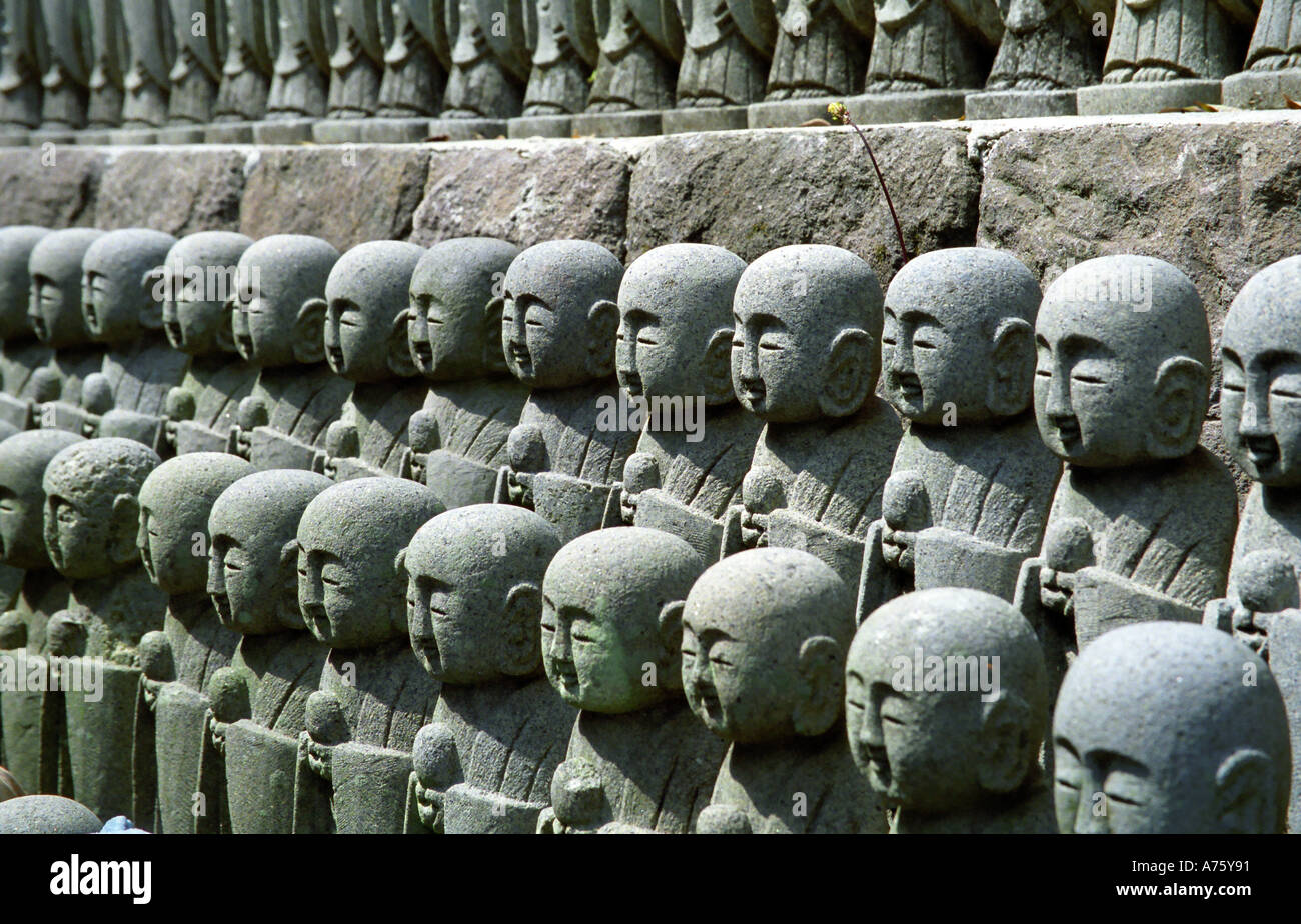 Rows of small statues of Jizo the guardian deity of children in close ...