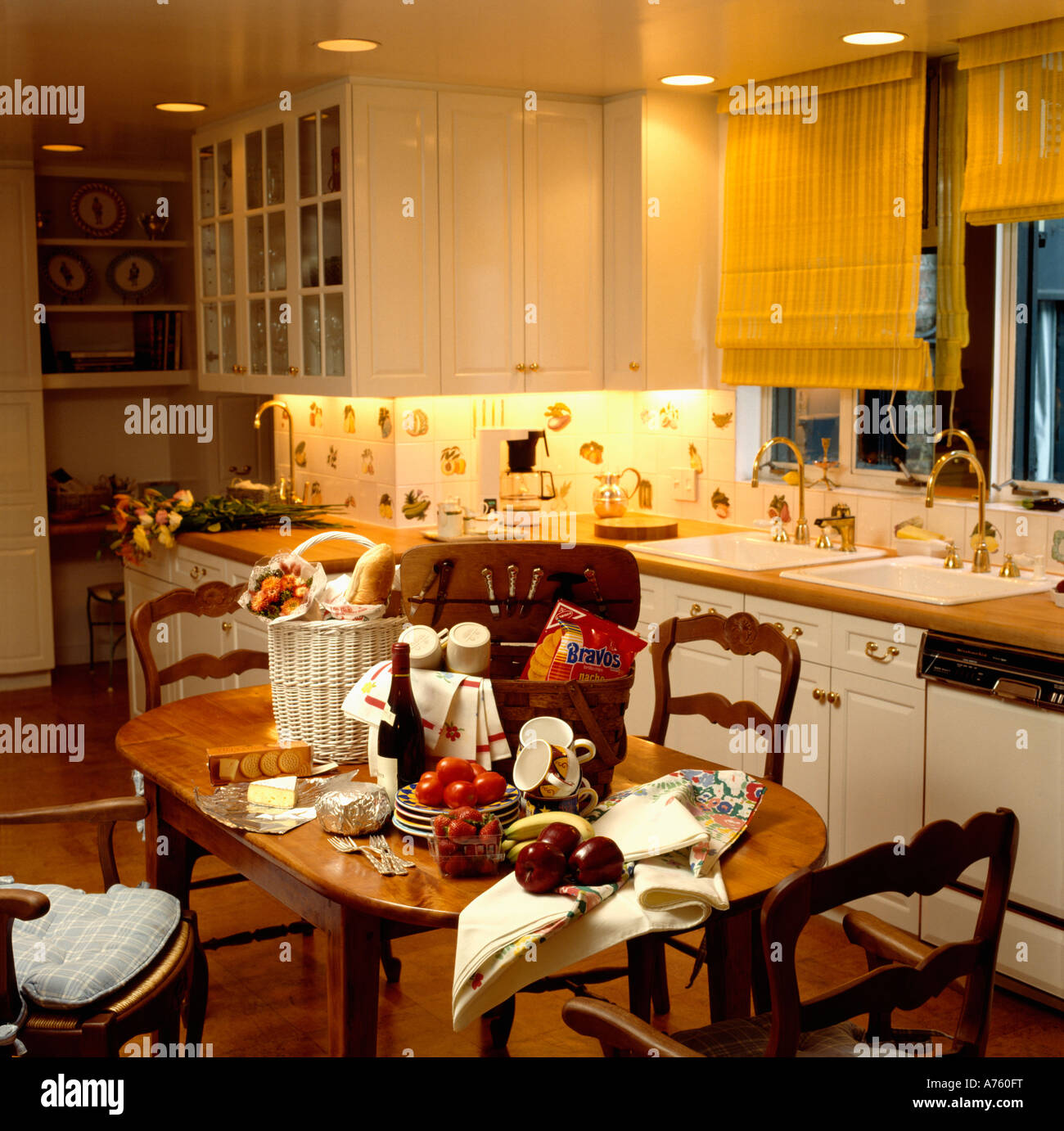 Eighties kitchen with wooden table and chairs and yellow blinds Stock ...