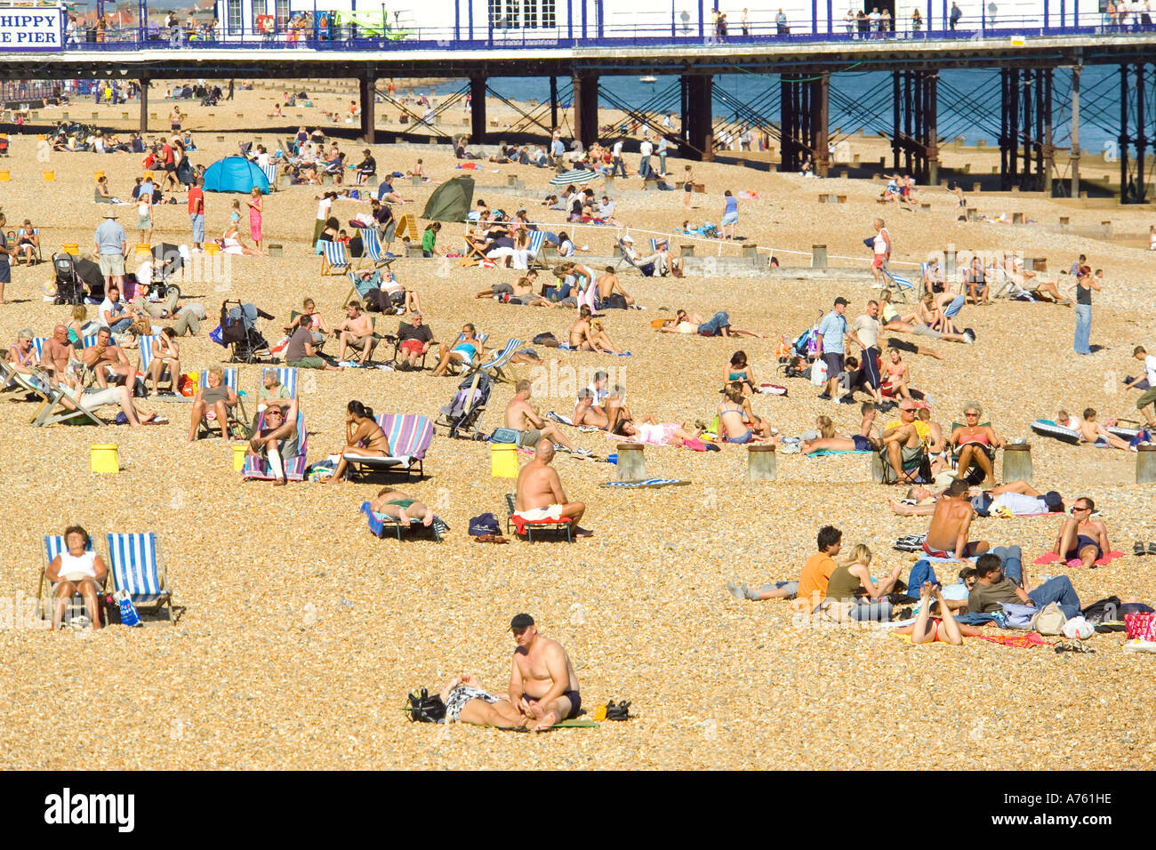 Compressed perspective view of a typical English beach scene in summer ...