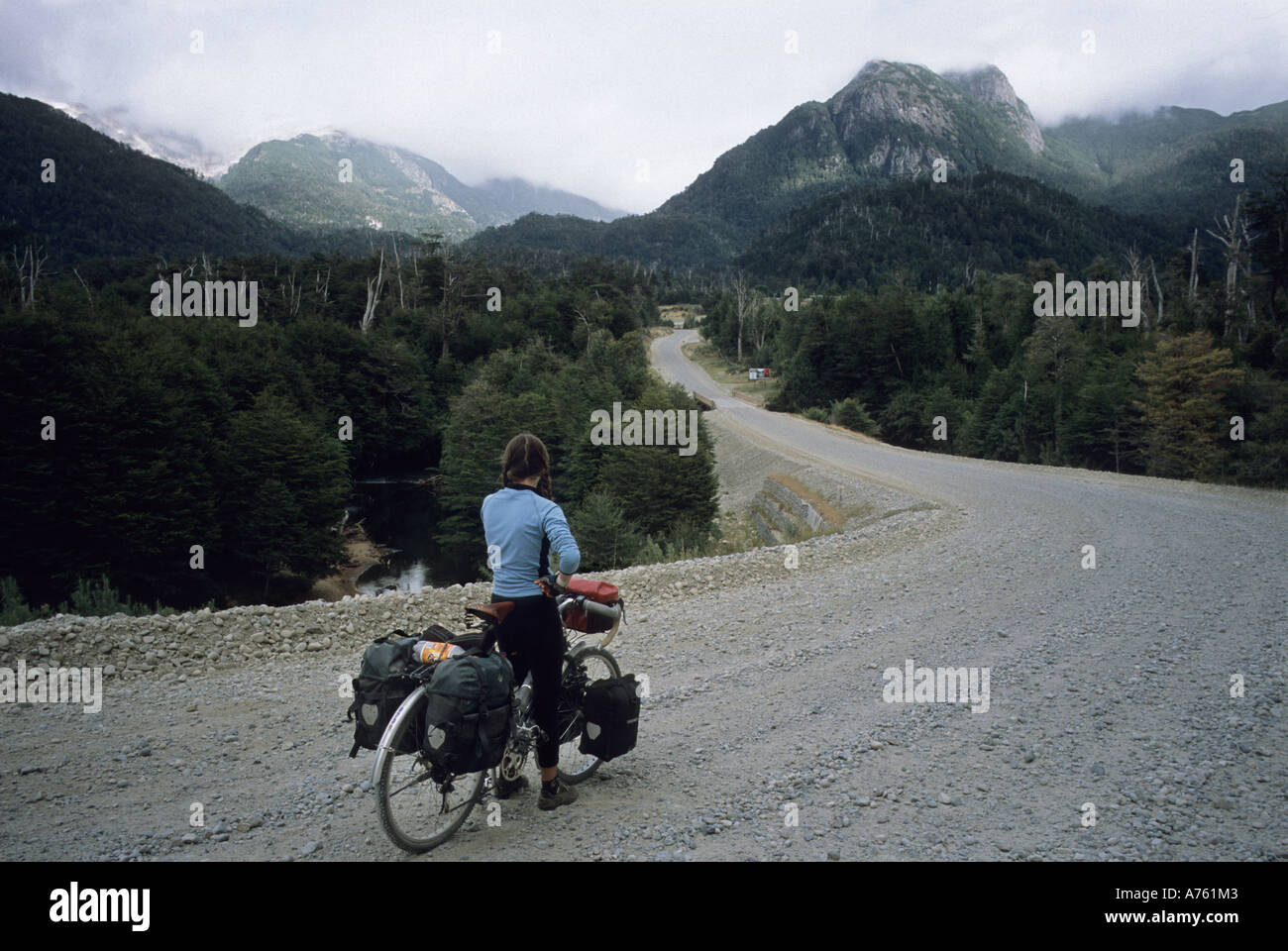 female expedition touring cyclist alone in vast landscape of chile with ...