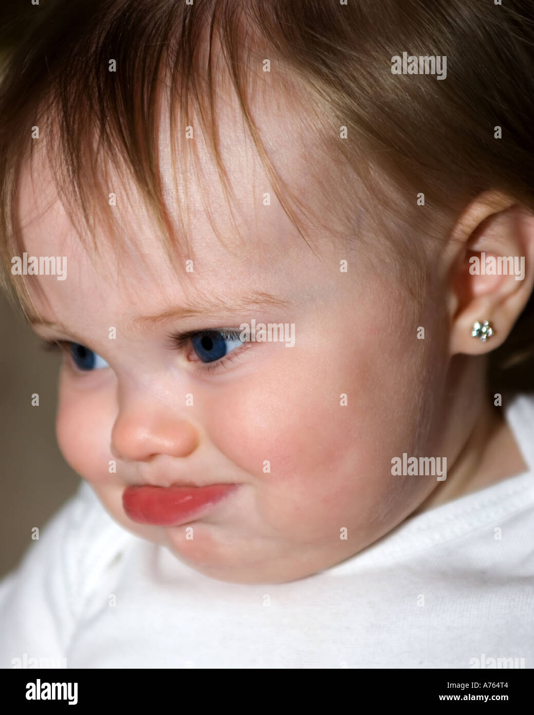 Baby girl big lip smile with determination Stock Photo - Alamy