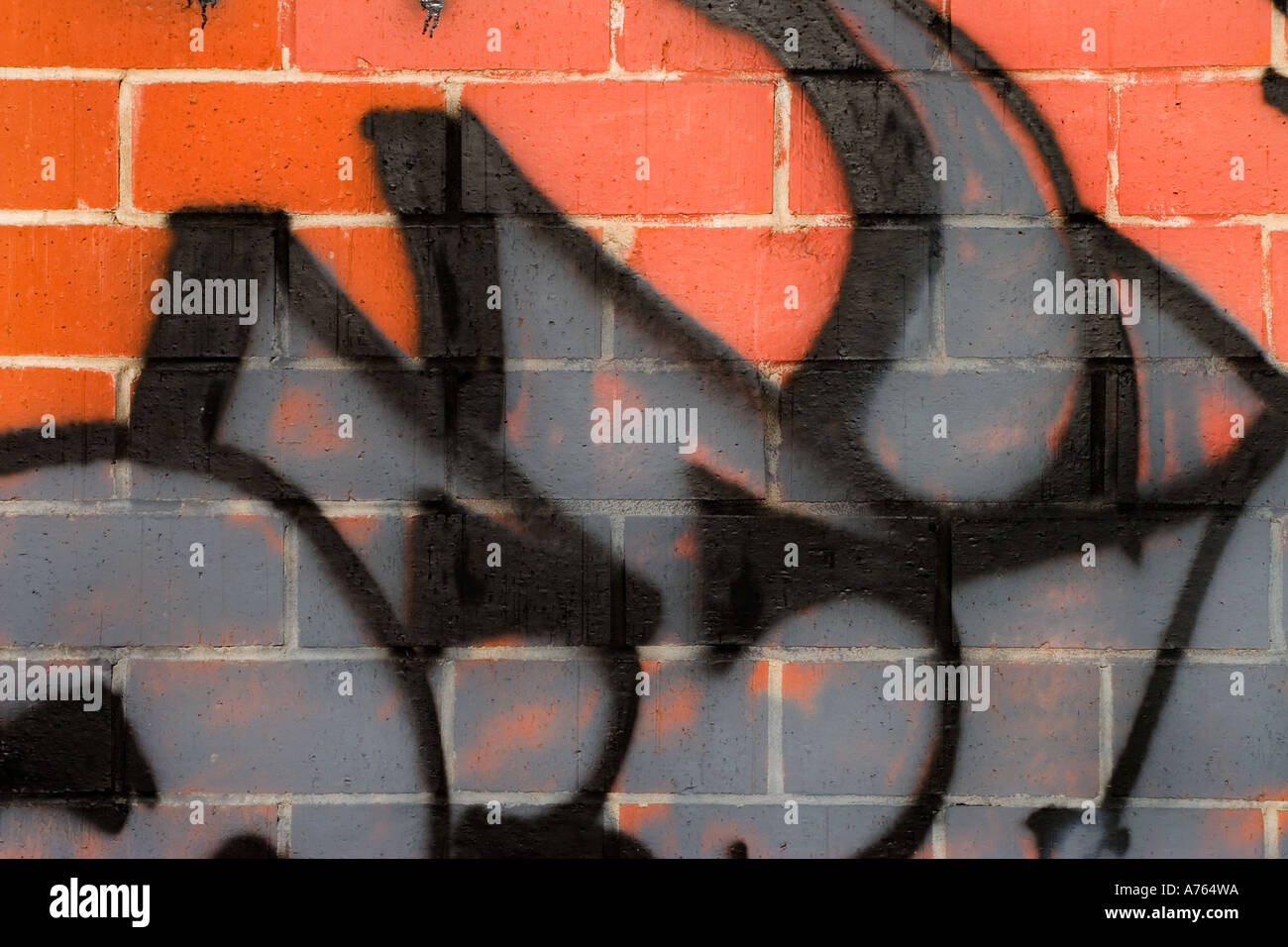 Wall painting brick black gray lettering on brick wall Stock Photo - Alamy